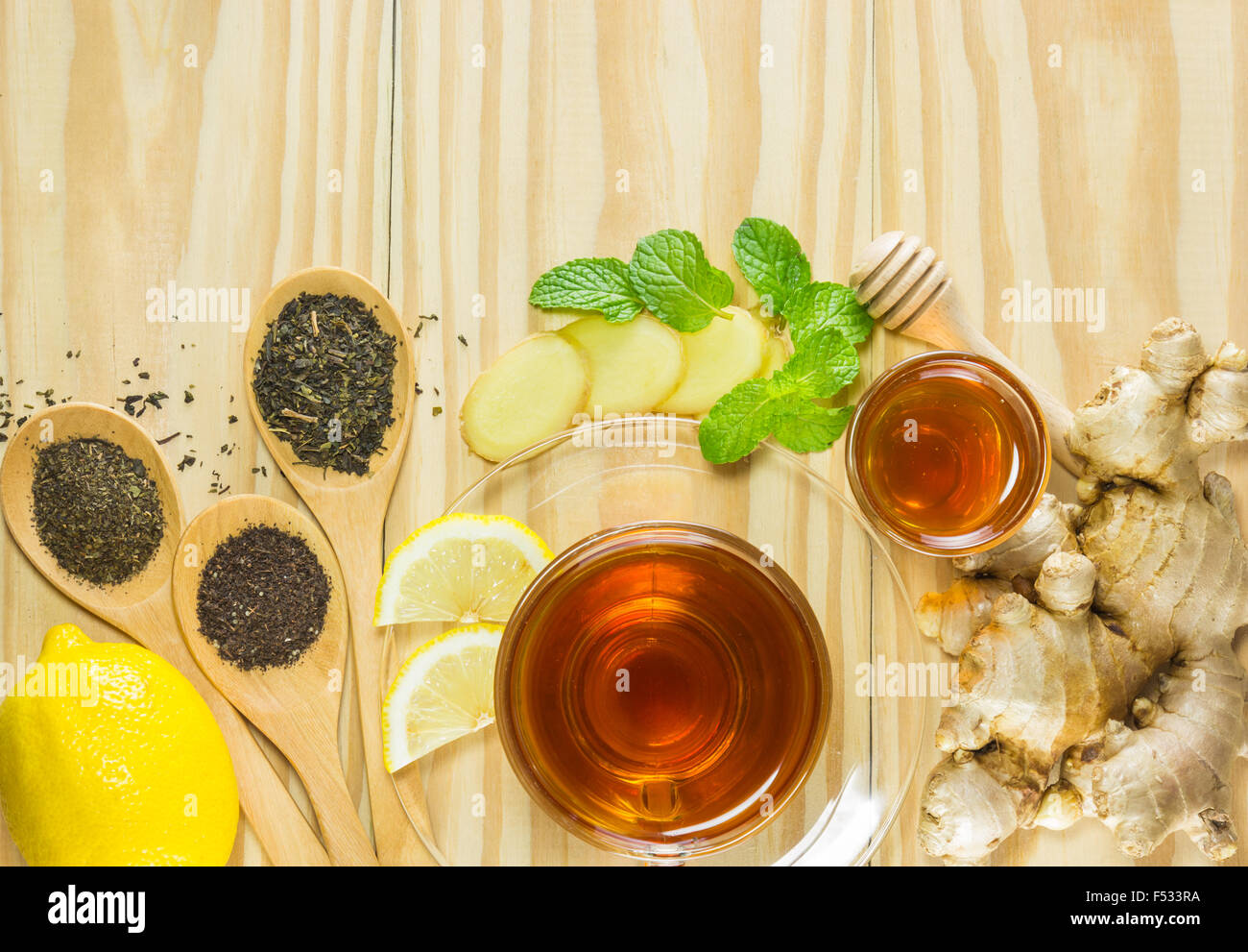 tea with mint honey ginger and lemon on wood background,warm toning ...