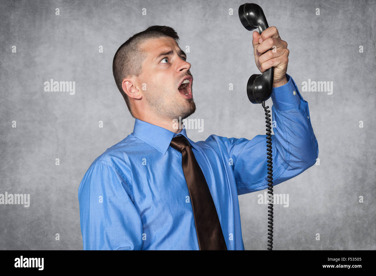 angry businessman screaming during a telephone conversation Stock Photo ...