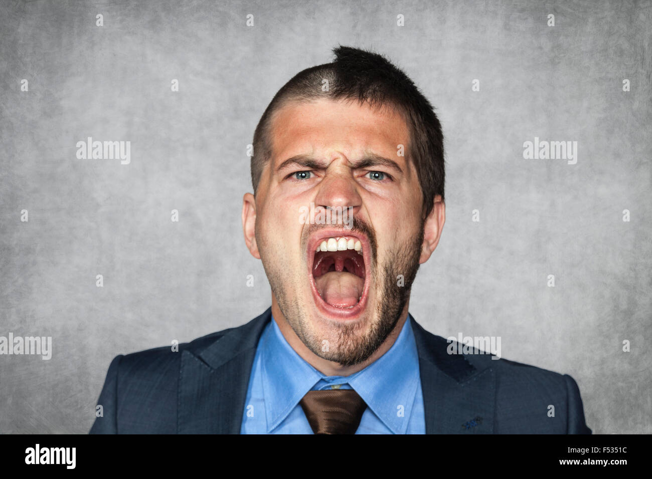 angry businessman screaming, funny haircut Stock Photo - Alamy