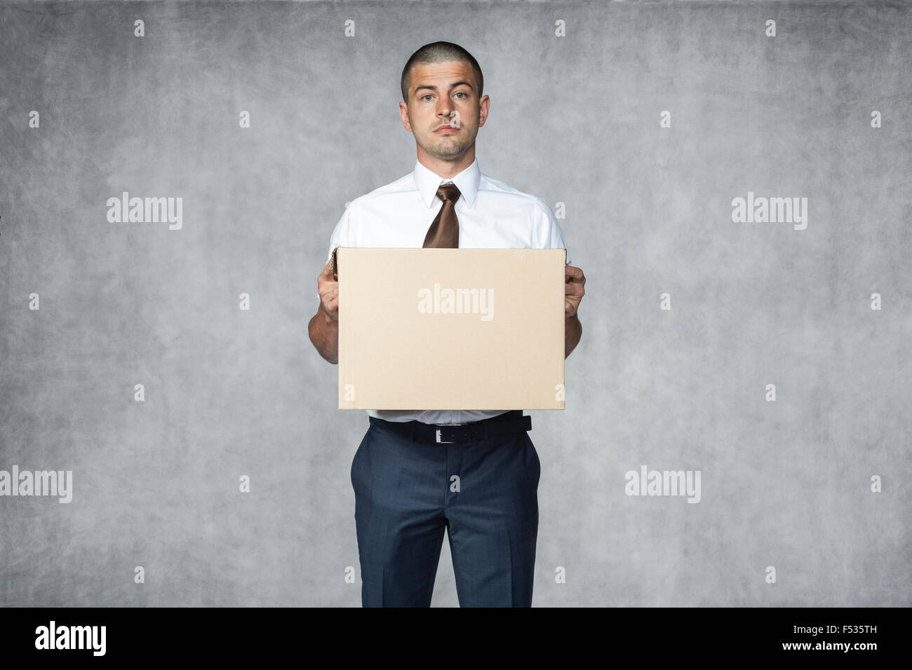 sad businessman loss his job, moving out from office, keeping his ...