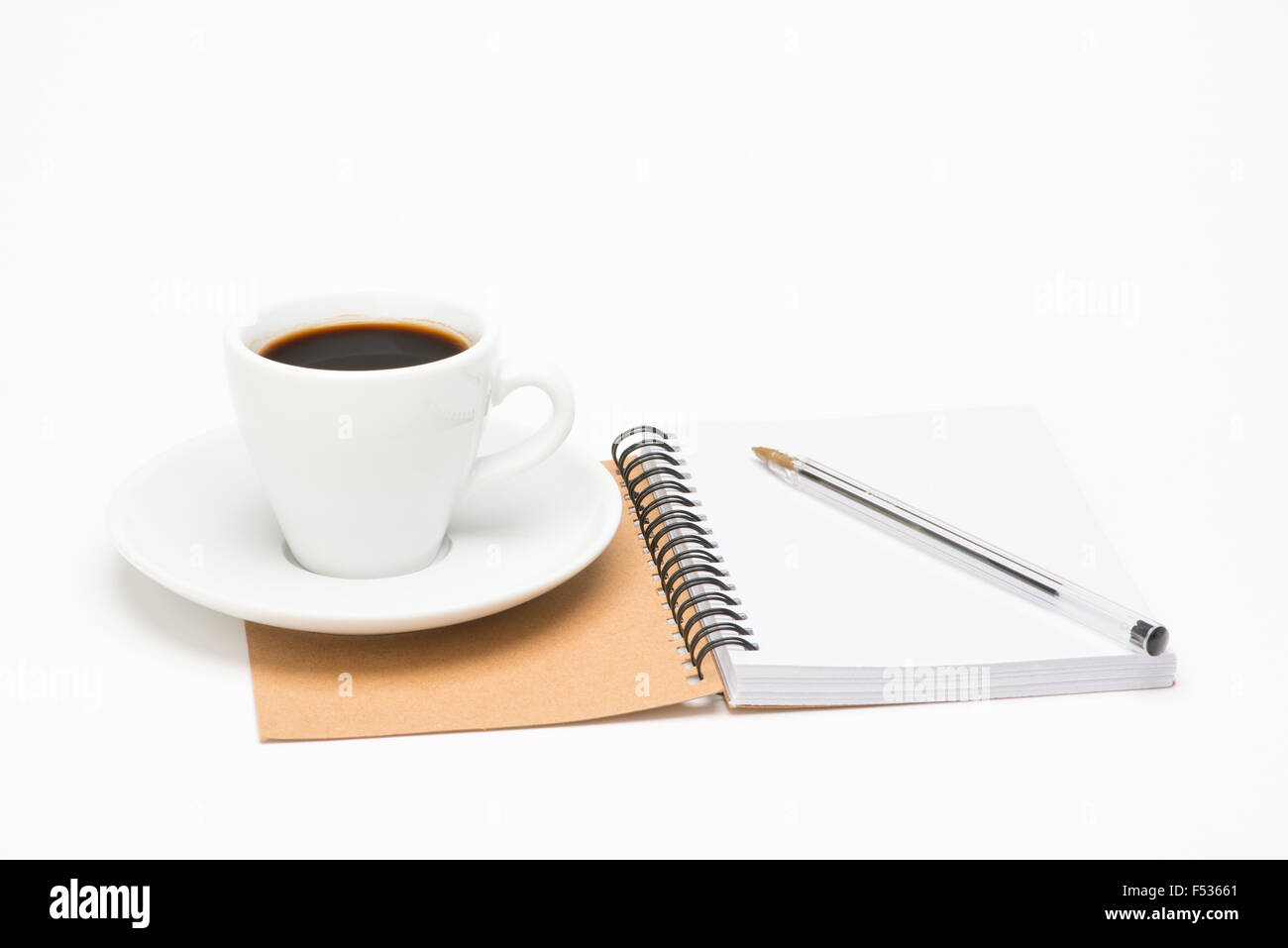 Cup of coffee with notebook on white background Stock Photo - Alamy