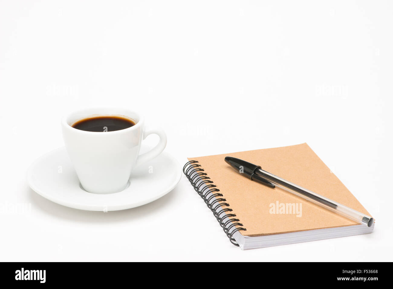 Cup of coffee with notebook on white background Stock Photo - Alamy