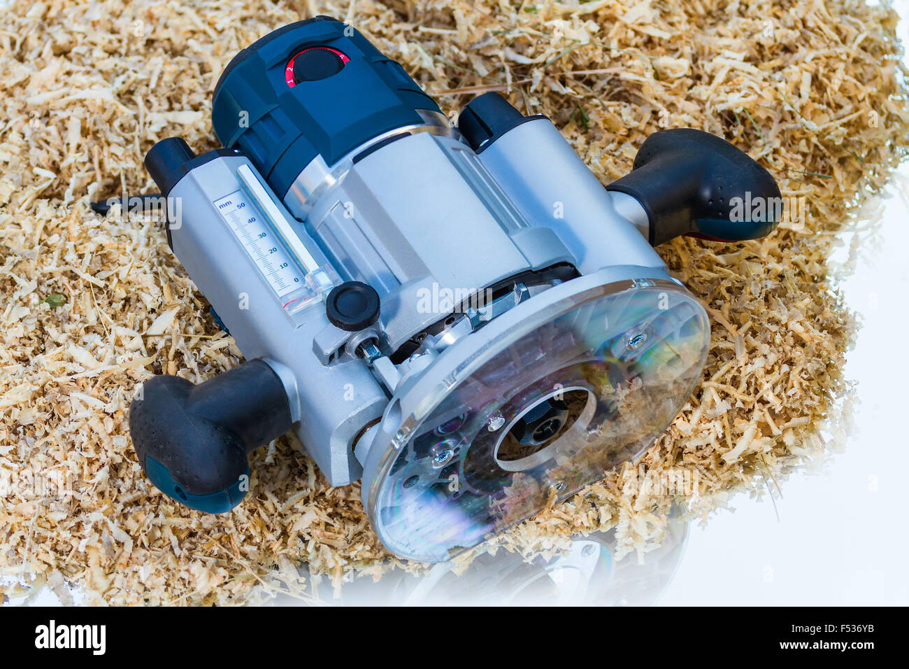 variable speed plunge router on sawdust background Stock Photo - Alamy