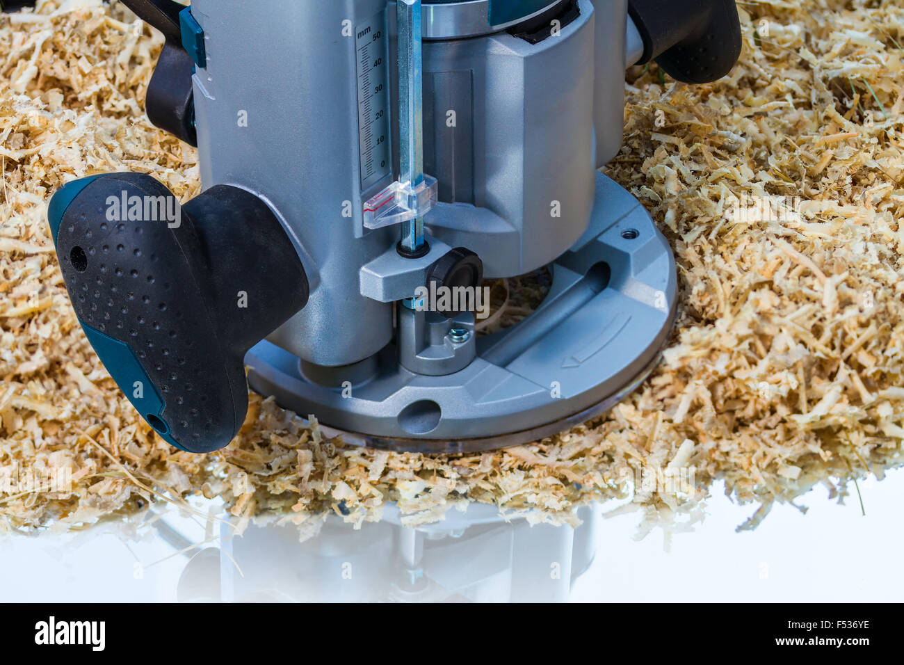 variable speed plunge router on sawdust background Stock Photo - Alamy