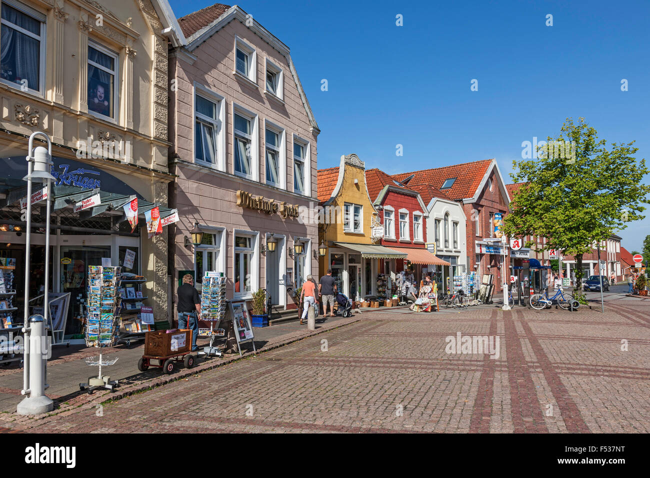 Shops on the marketplace in the old town of Esens, Harlingerland, East ...