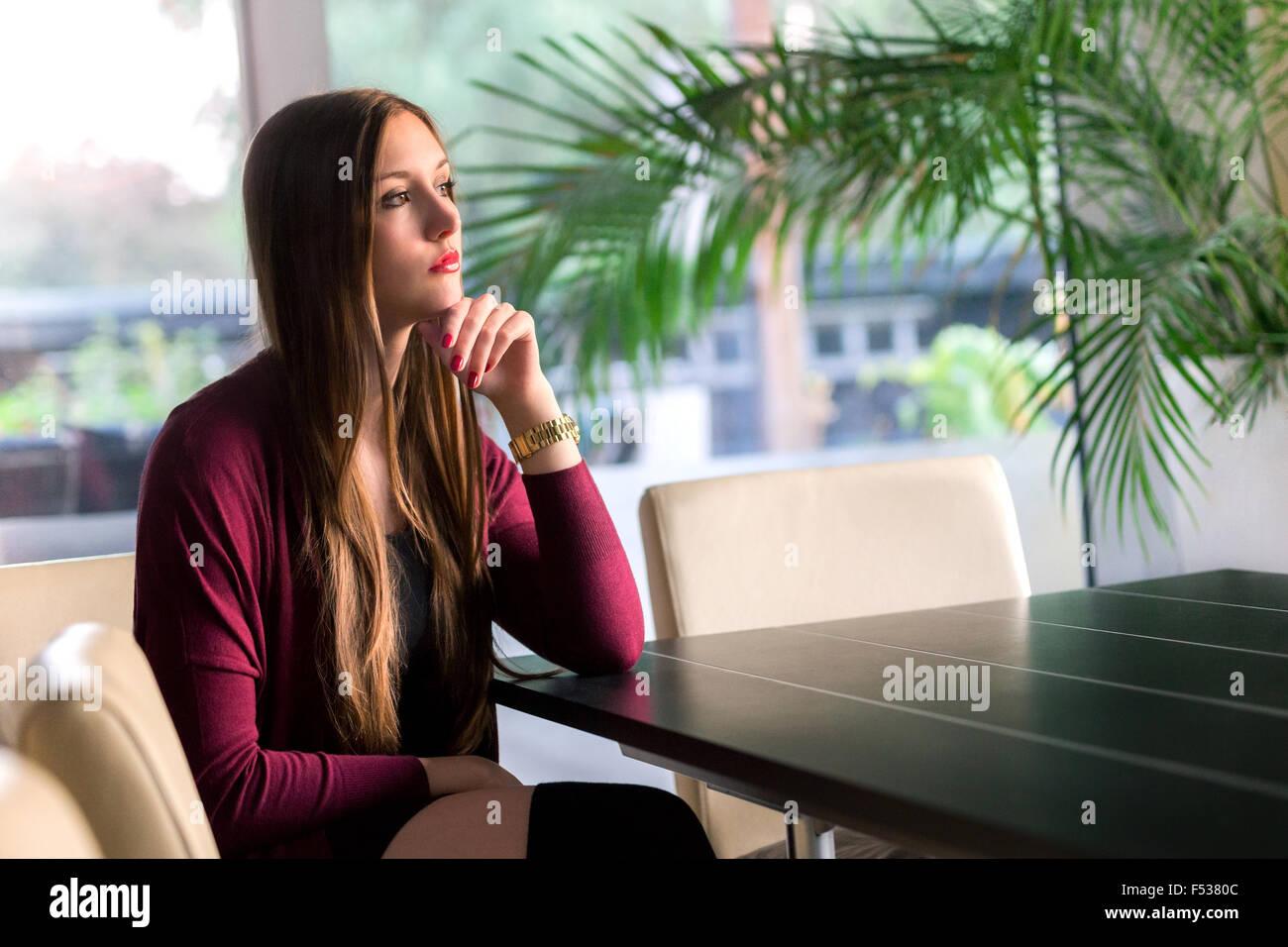 Young girl sitting table mr hi-res stock photography and images - Alamy