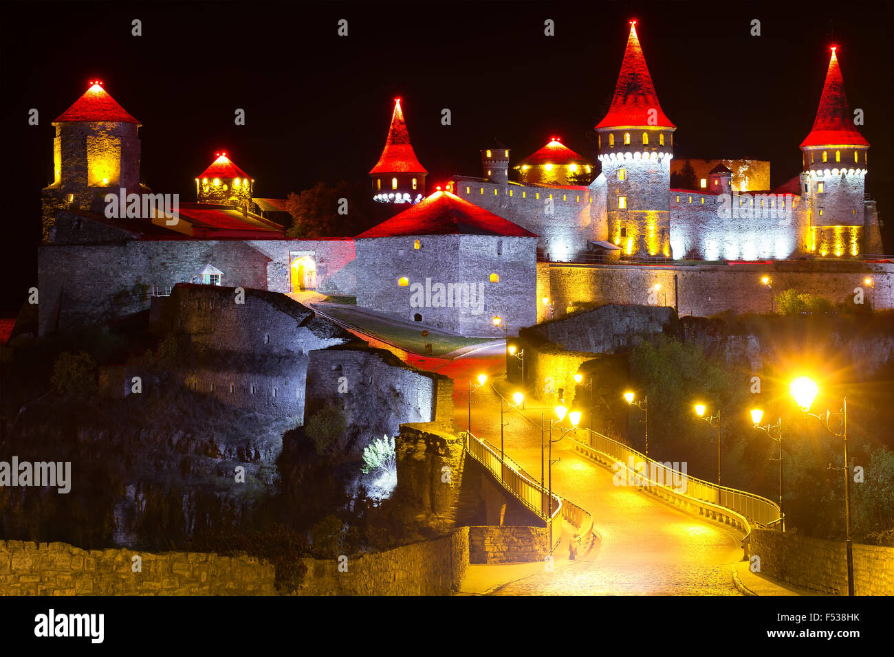 Old fortress with red towers shot at night Stock Photo - Alamy