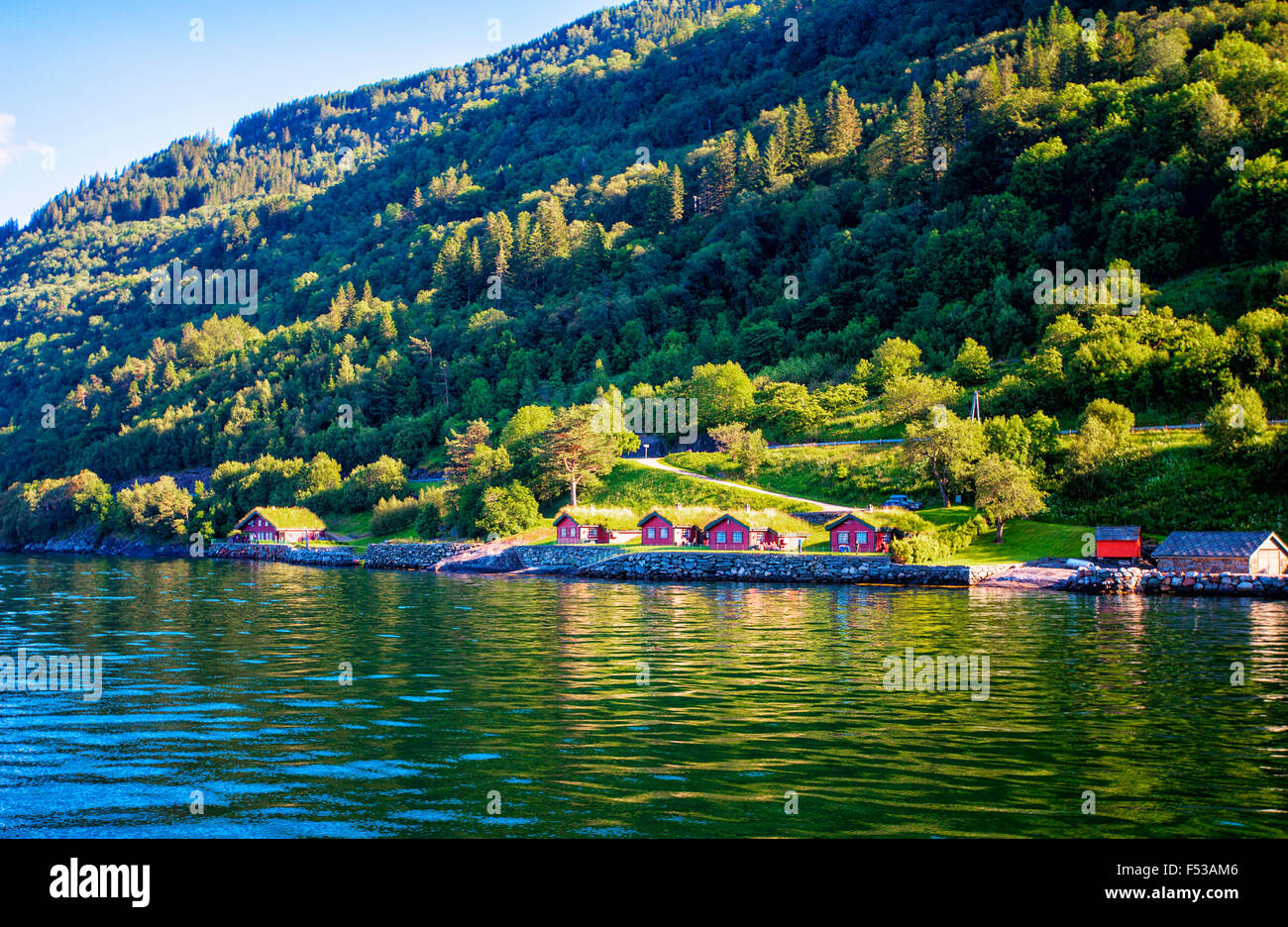 Meadows and village on Hardanger Fiord. Norway shore with view. Norway ...