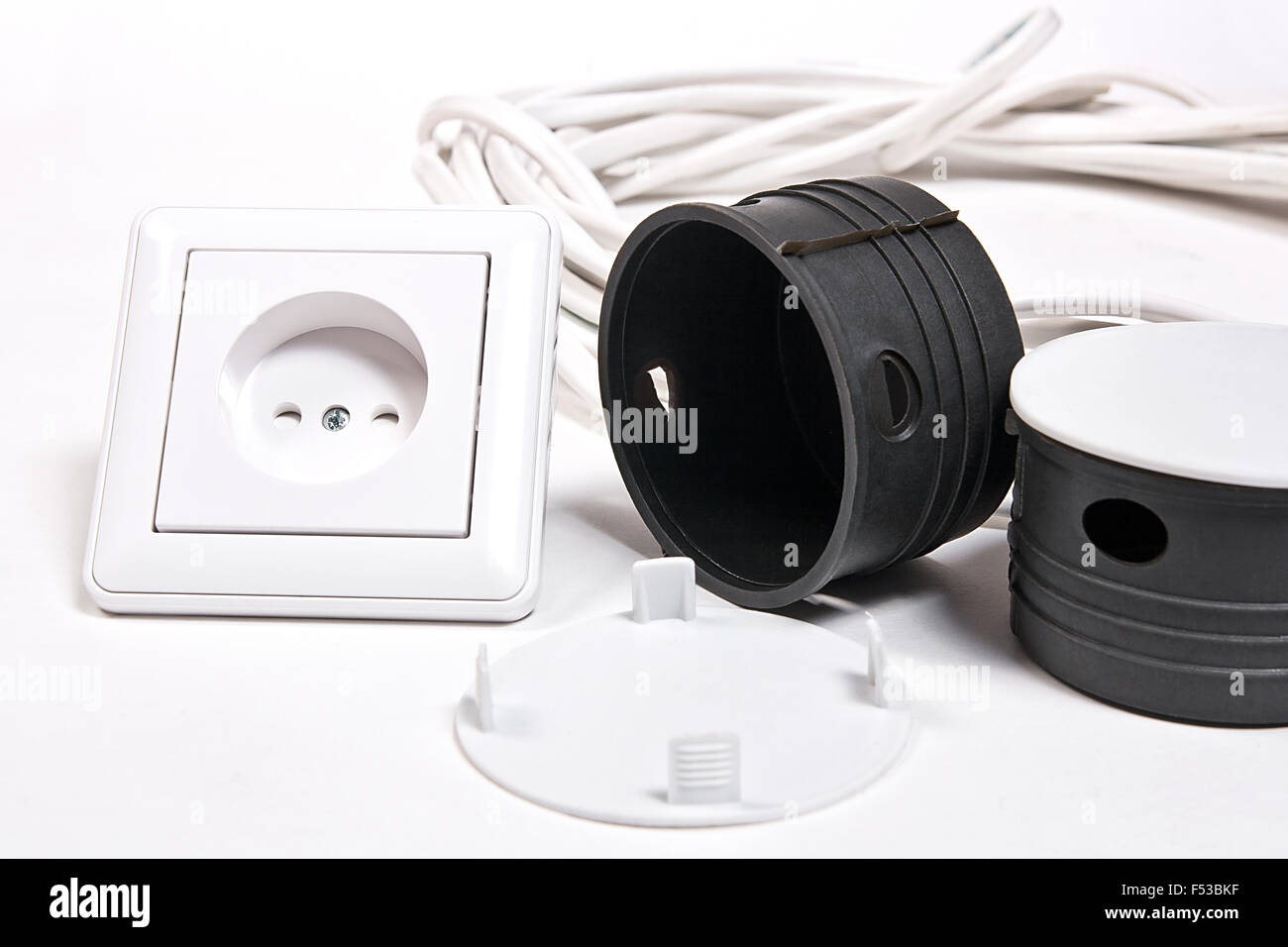 Electric wall socket, socket box, power cable on white background Stock ...