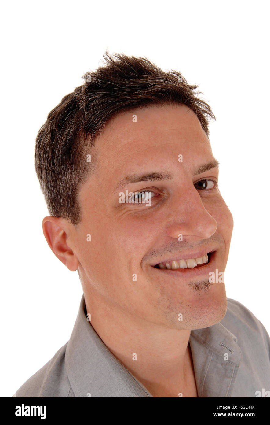 A closeup head shoot of a happy smiling young man, isolated for white ...