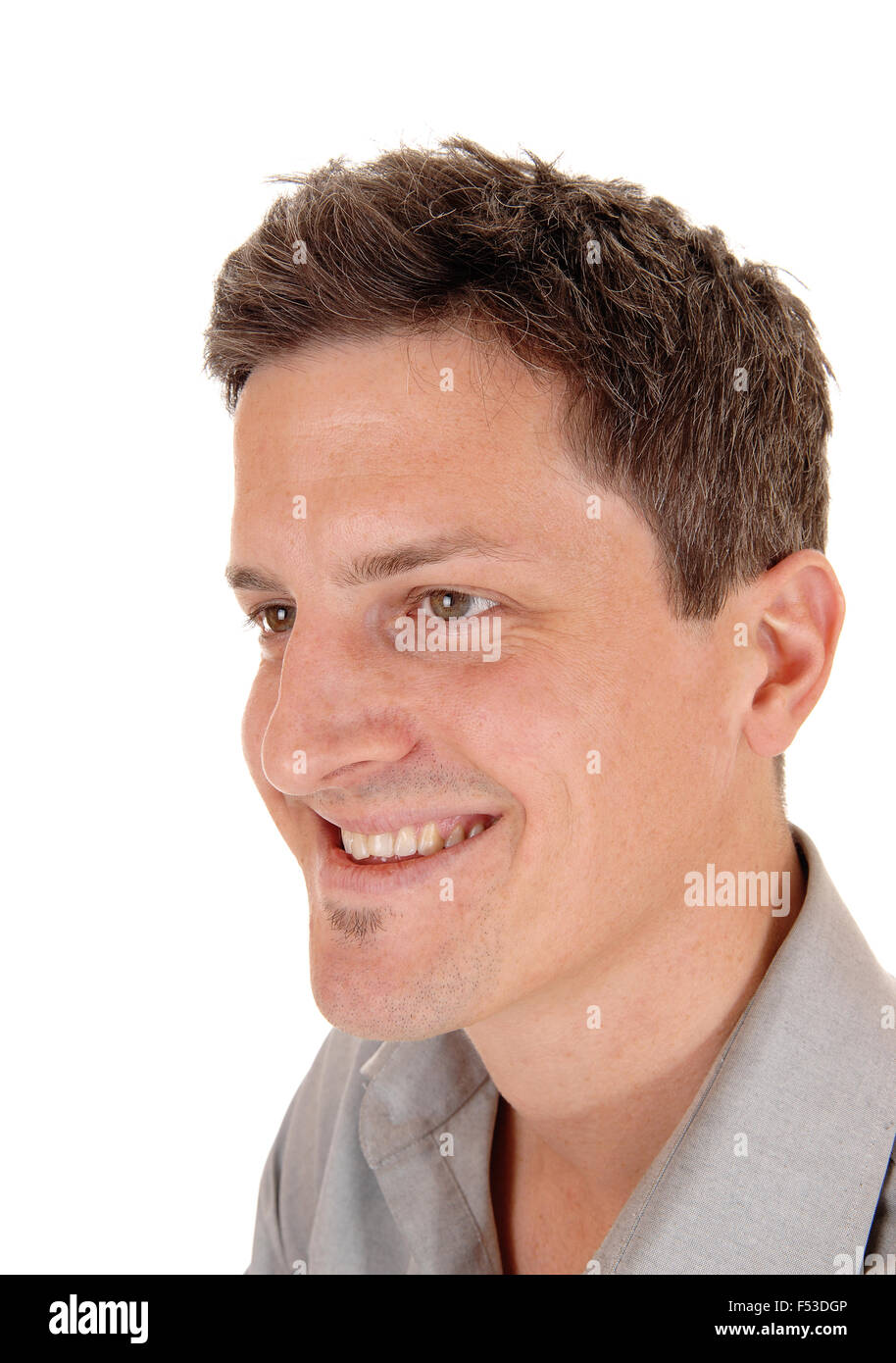 A closeup head shoot of a happy smiling young man, isolated for white ...