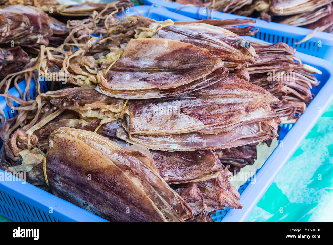 Dried squid are the food of the fishermen Stock Photo - Alamy
