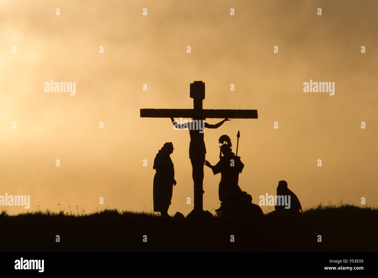 Crucifixion scene with actors in silhouette Stock Photo - Alamy