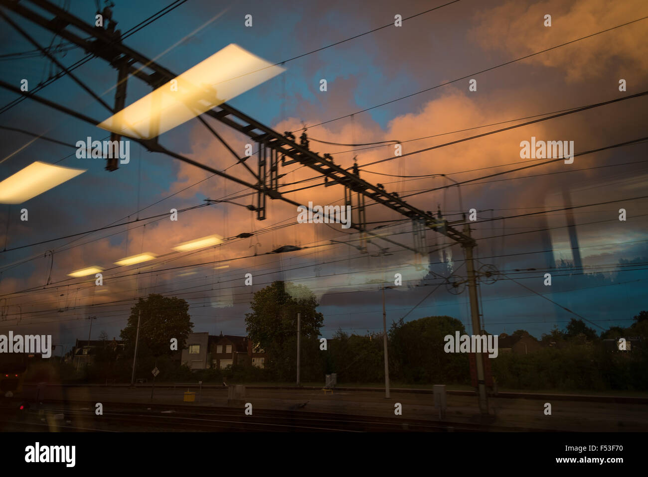 reflections in train window, sunset, Belgium Stock Photo - Alamy