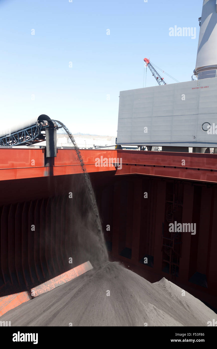 loading product onto a bulk ship Stock Photo - Alamy
