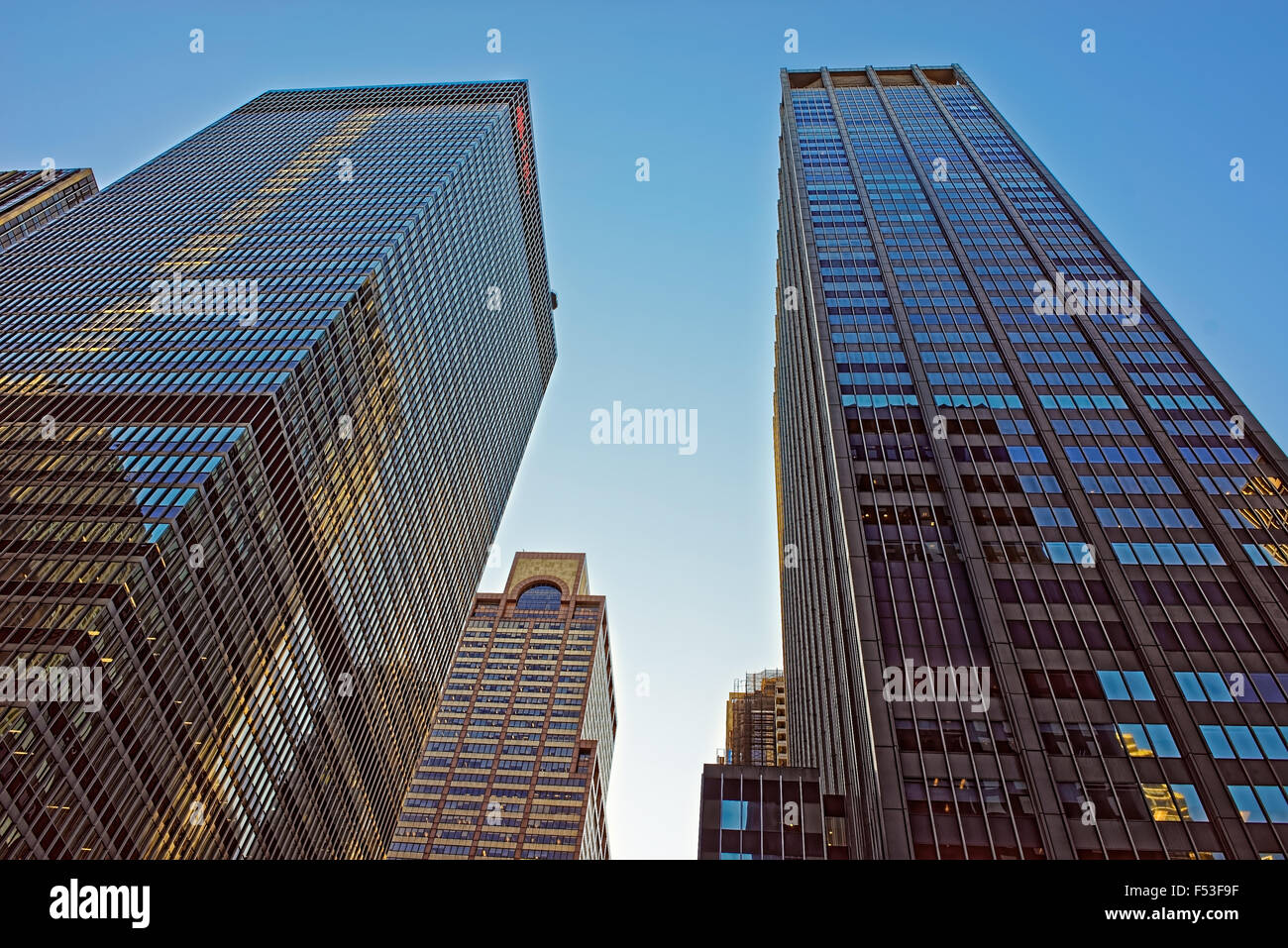 High modern skyscrapers rising up to deep blue sky in New York City ...