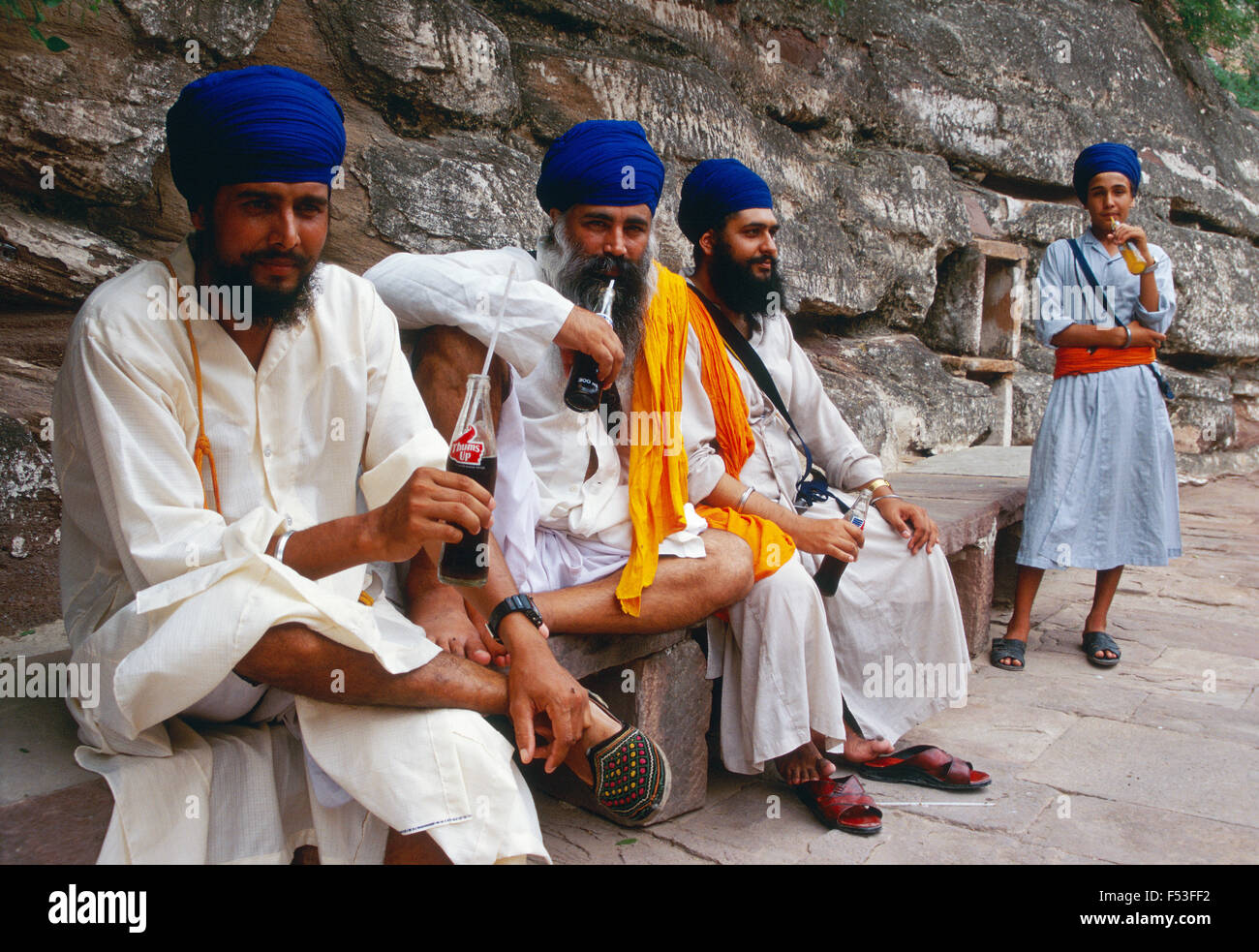 Sikh men drinking cold drinks while visiting the Mehrangarh fort ...