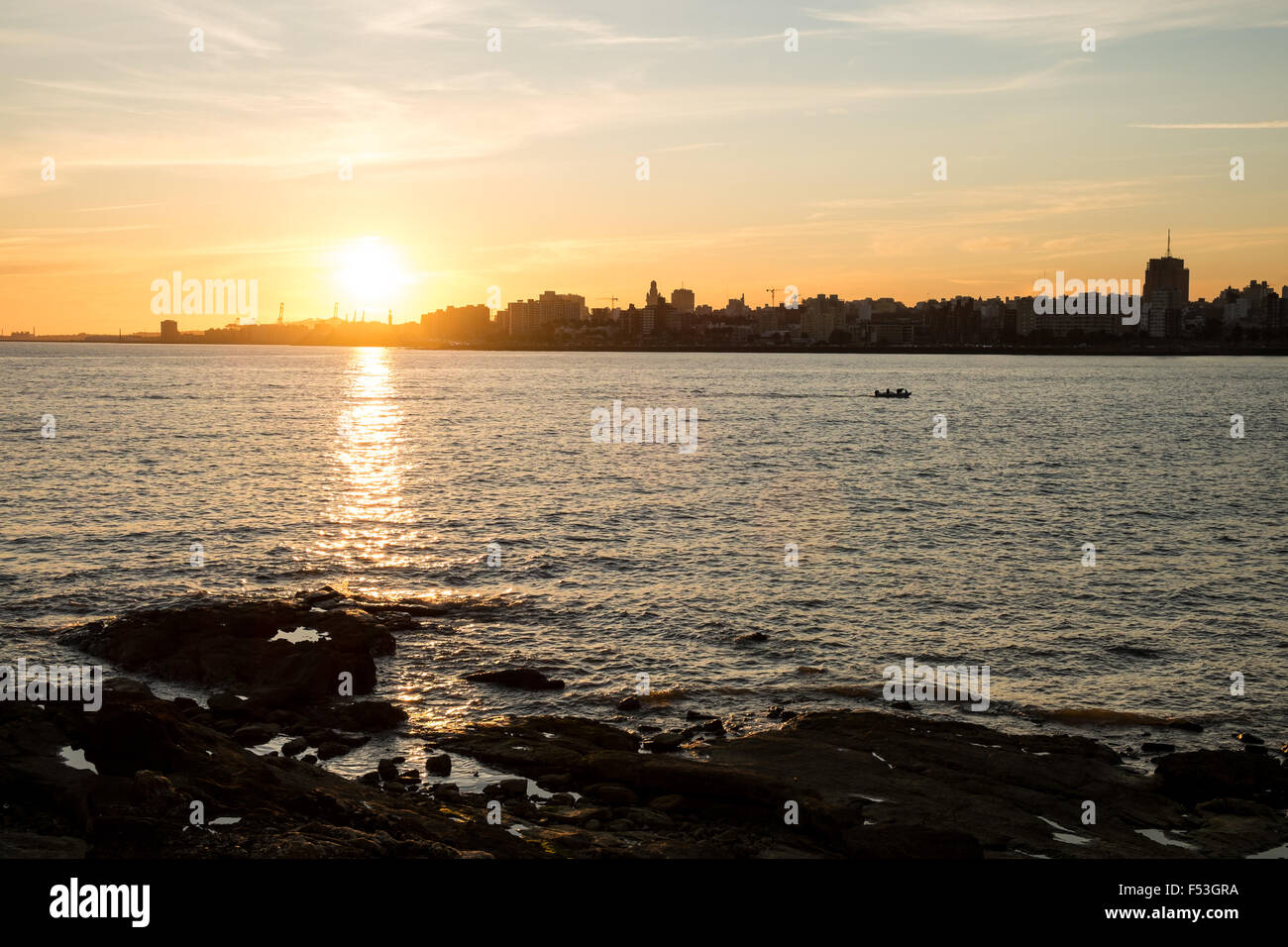 Sunset over Rio de la Plata with Montevideo skyline in the background ...