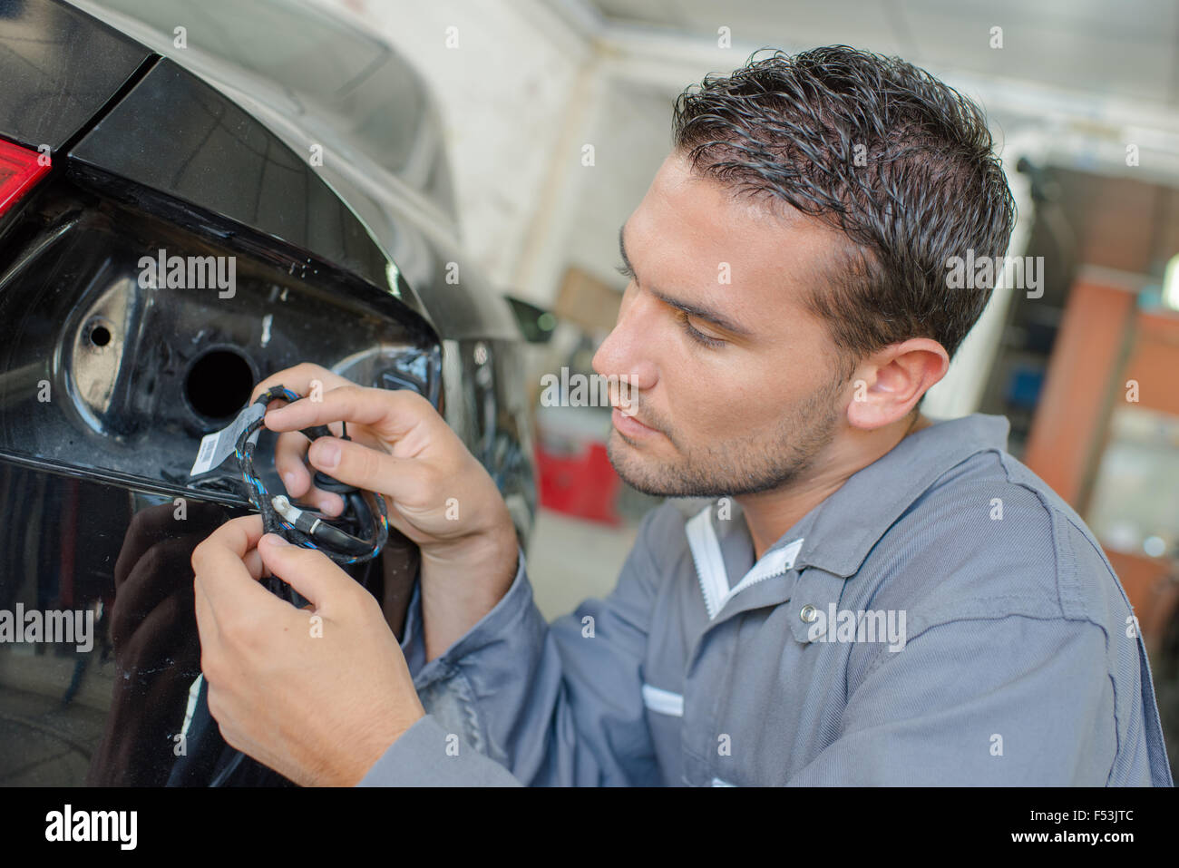 Mechanic changing a bulb Stock Photo - Alamy