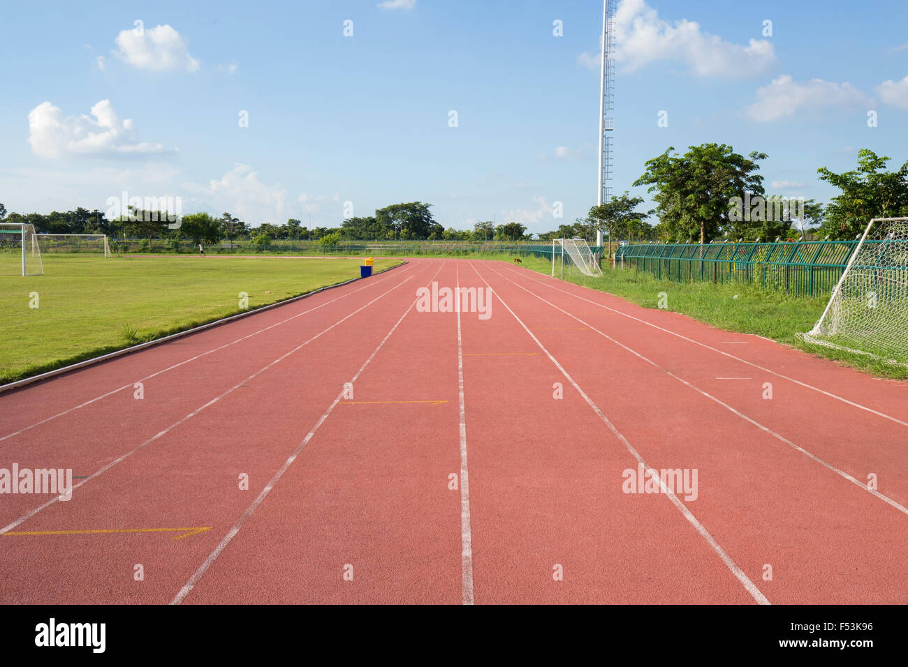 empty outdoor racetrack with blue sky Stock Photo - Alamy