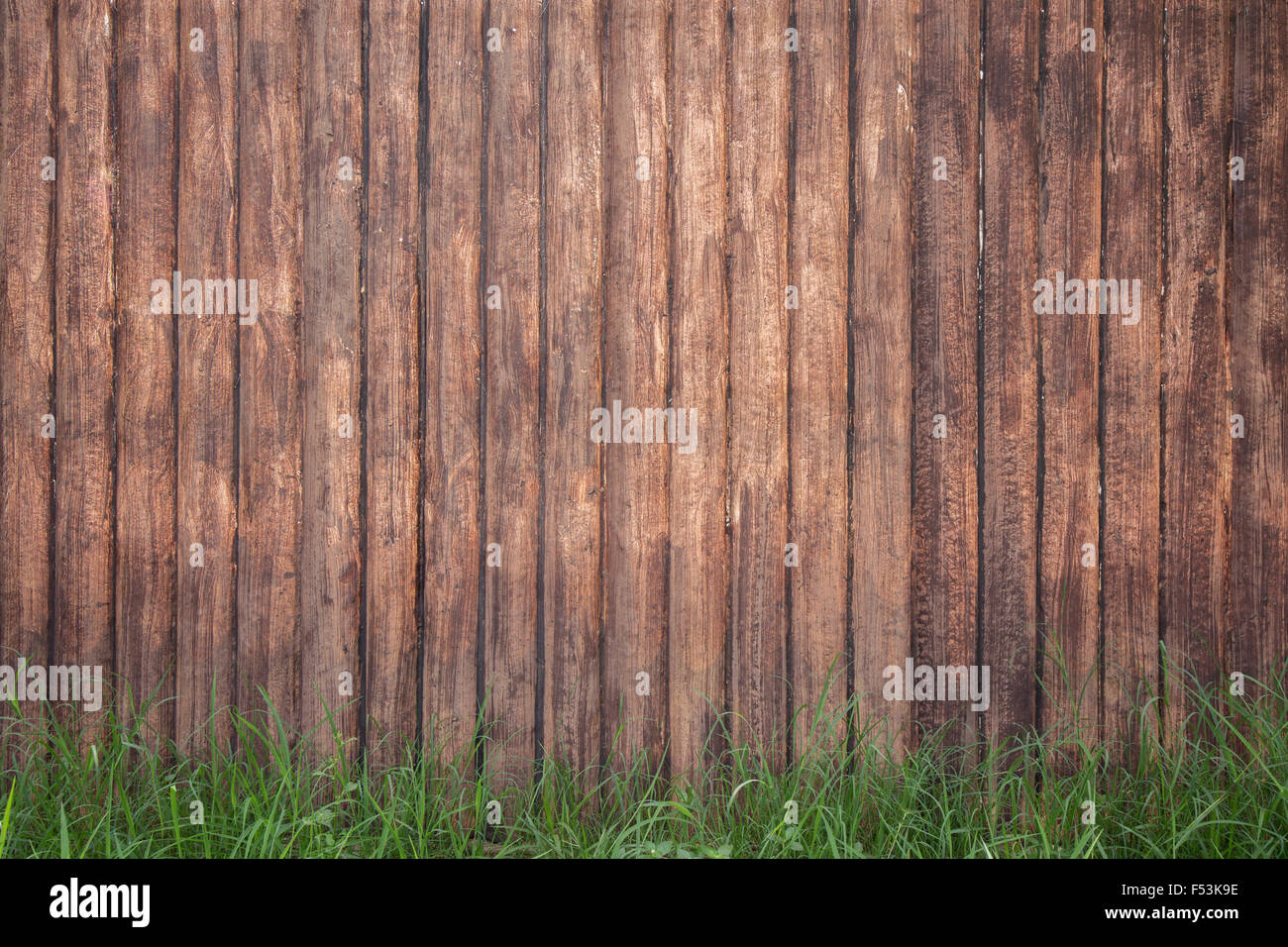 brown wood fence background with green grass Stock Photo - Alamy