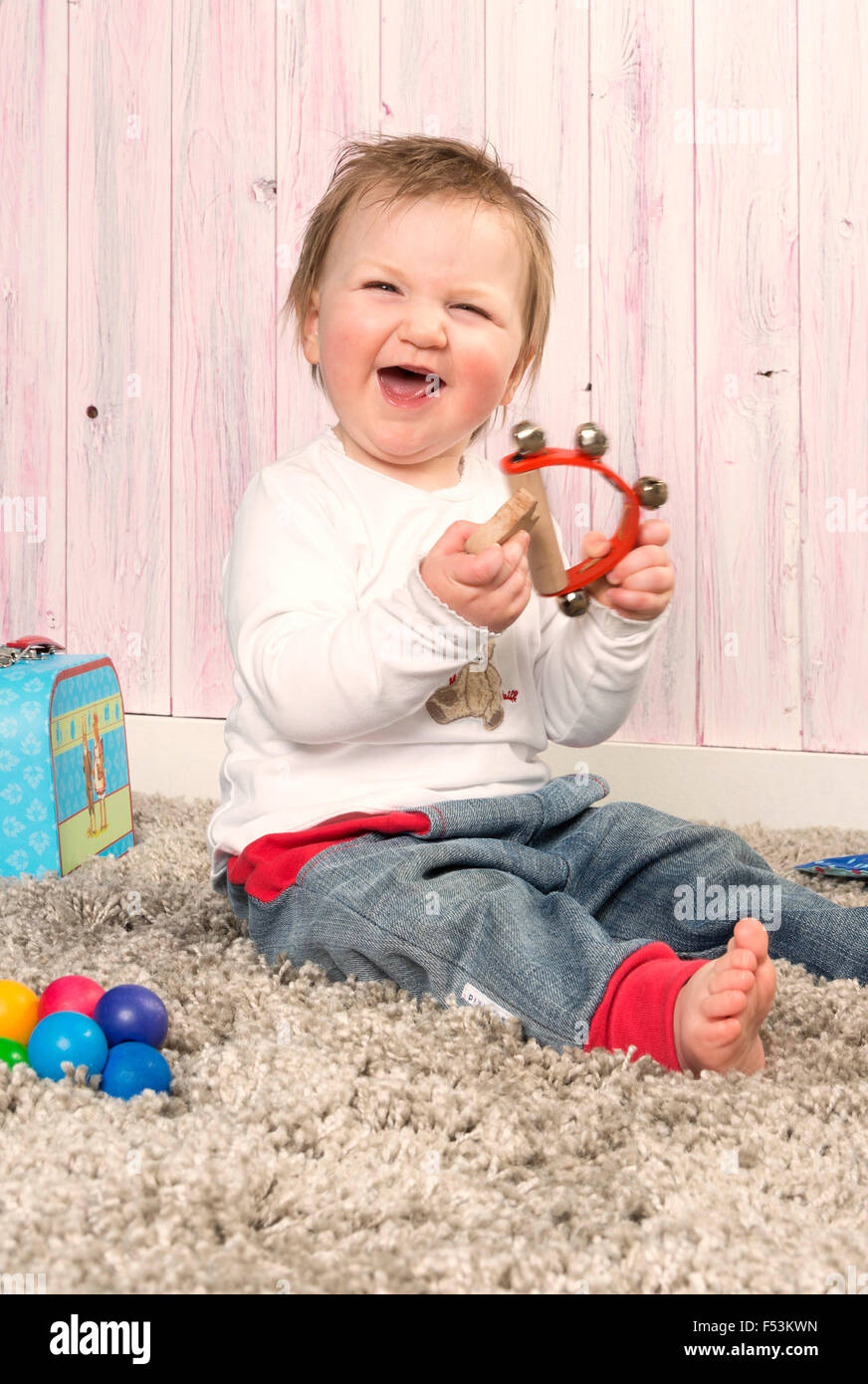 Baby toddler rattle hi-res stock photography and images - Alamy