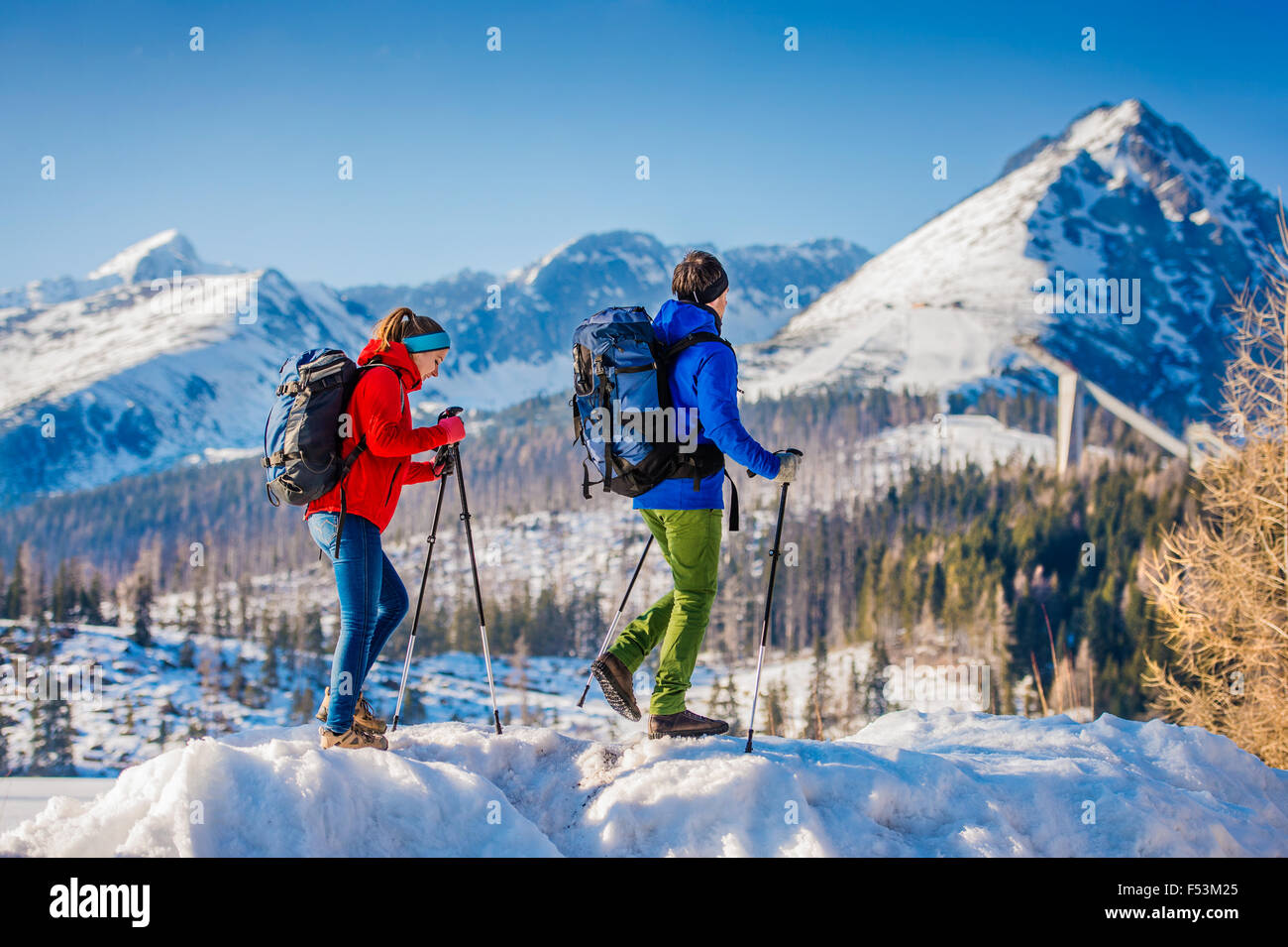 Young people on winter hike hi-res stock photography and images - Alamy