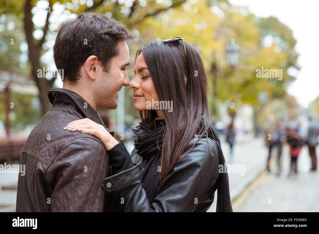 Portrait of romantic couple hugging outdoors Stock Photo - Alamy