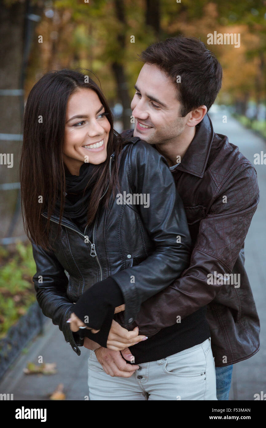 Portrait of a happy romantic couple having date outdoors Stock Photo ...