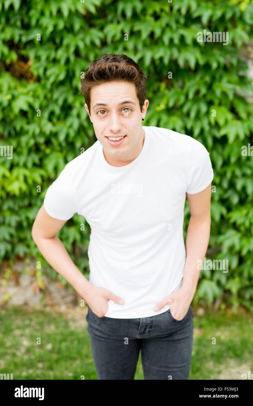 Knee figure of young handsome caucasian brown hair man looking in ...