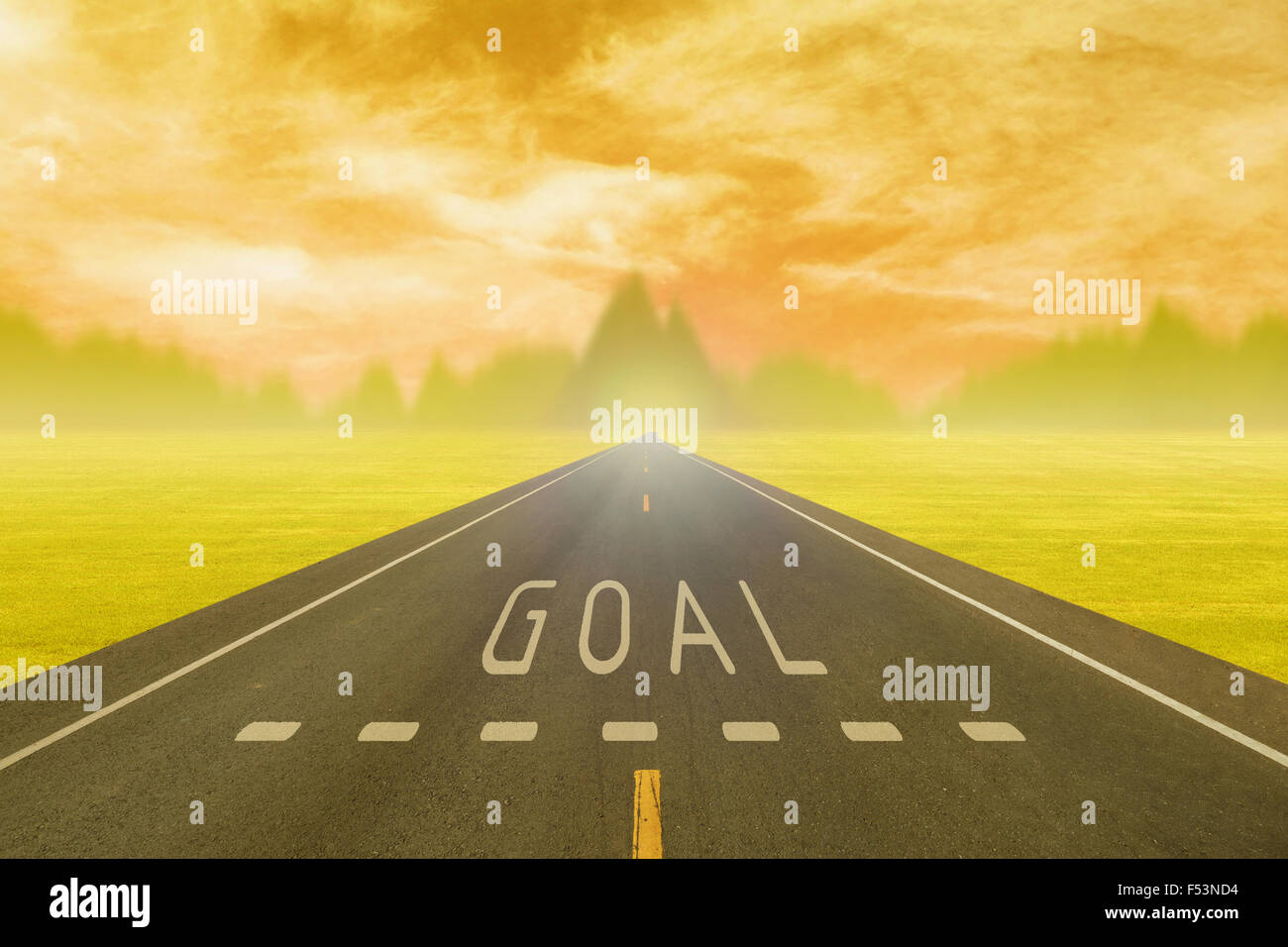 empty road through the field with sign goal on asphalt at sunset Stock ...