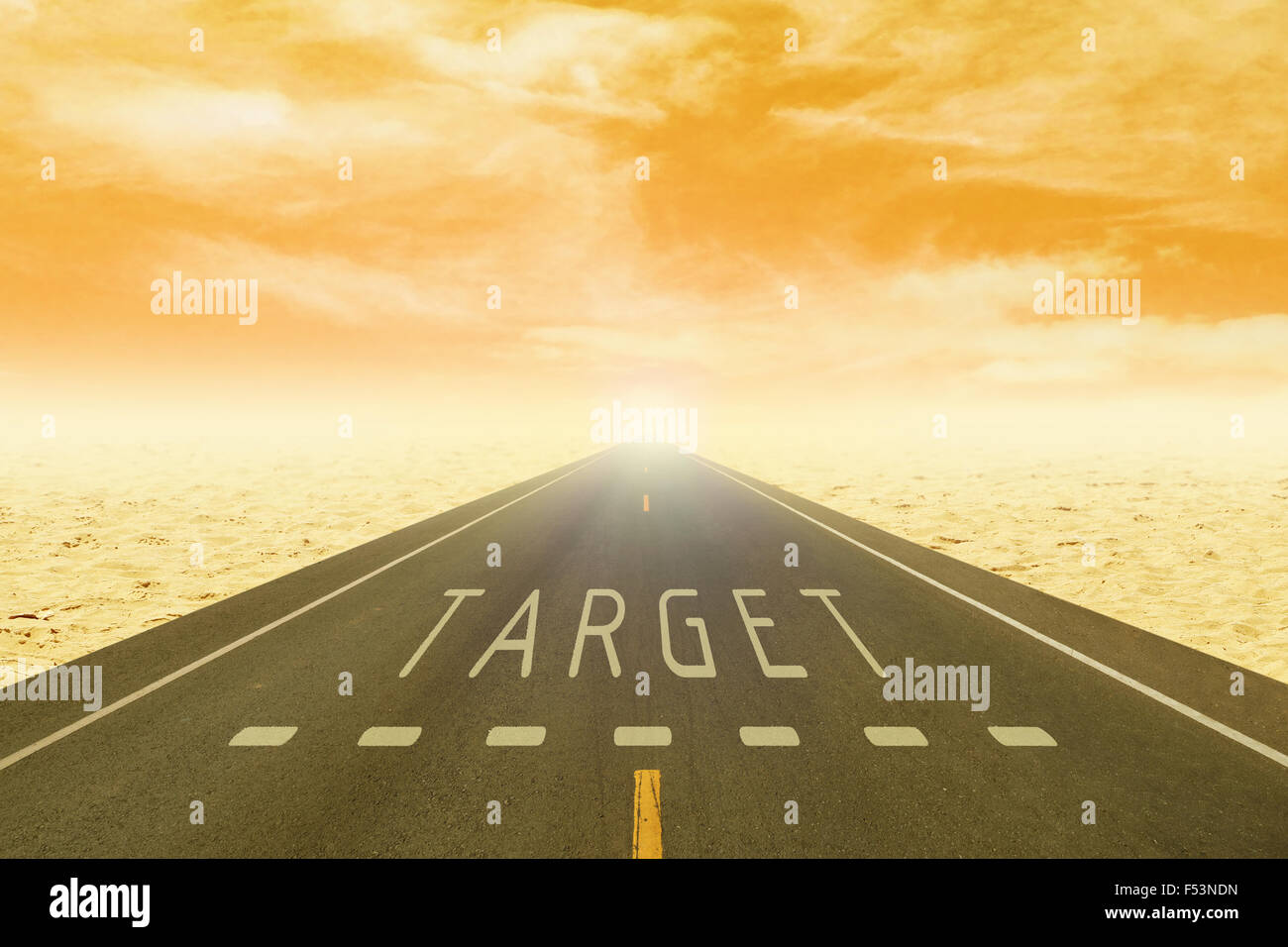 empty road through the desert with sign target on asphalt at sunset ...