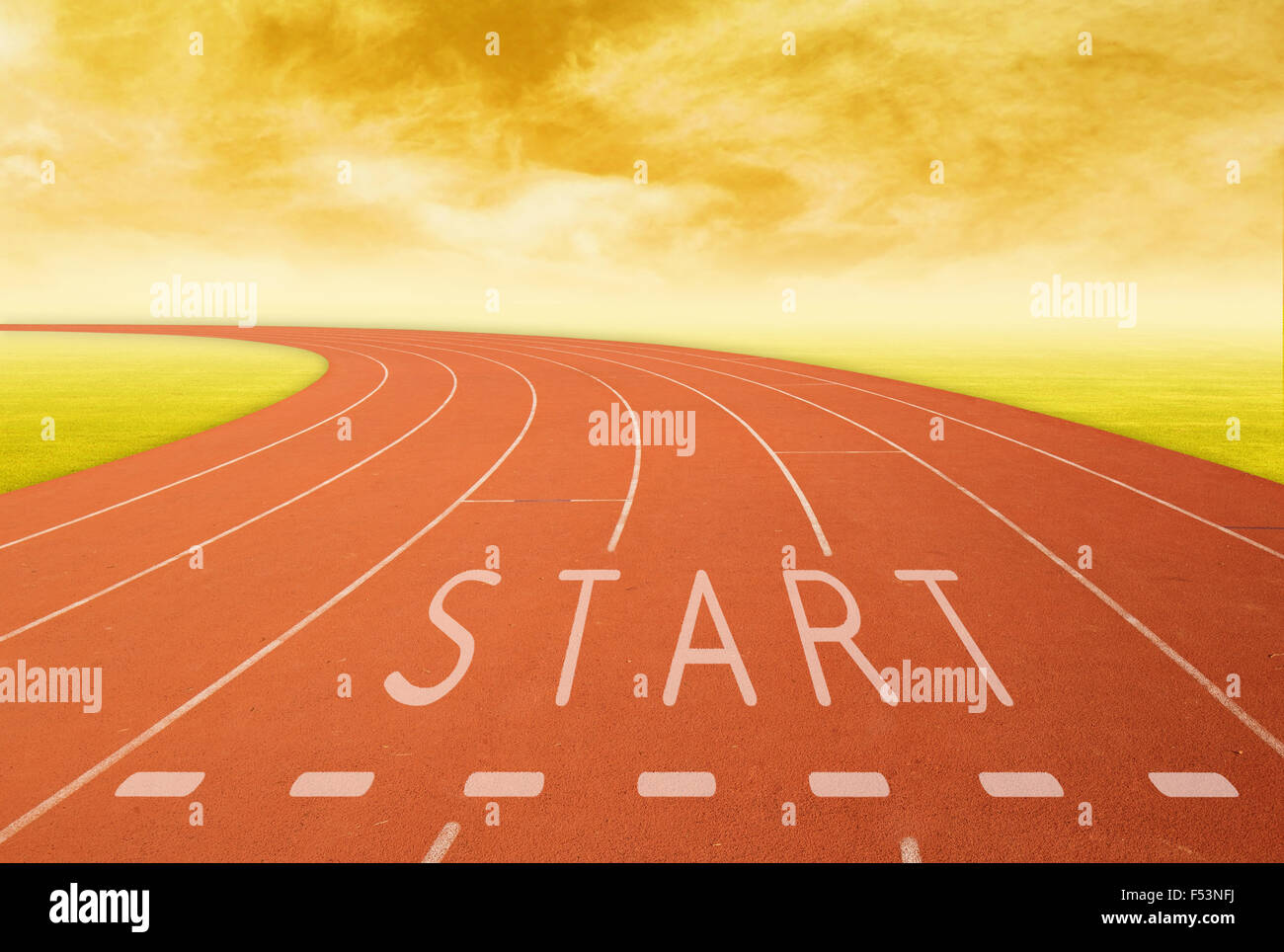 empty outdoor running track with sign start at sunset Stock Photo - Alamy