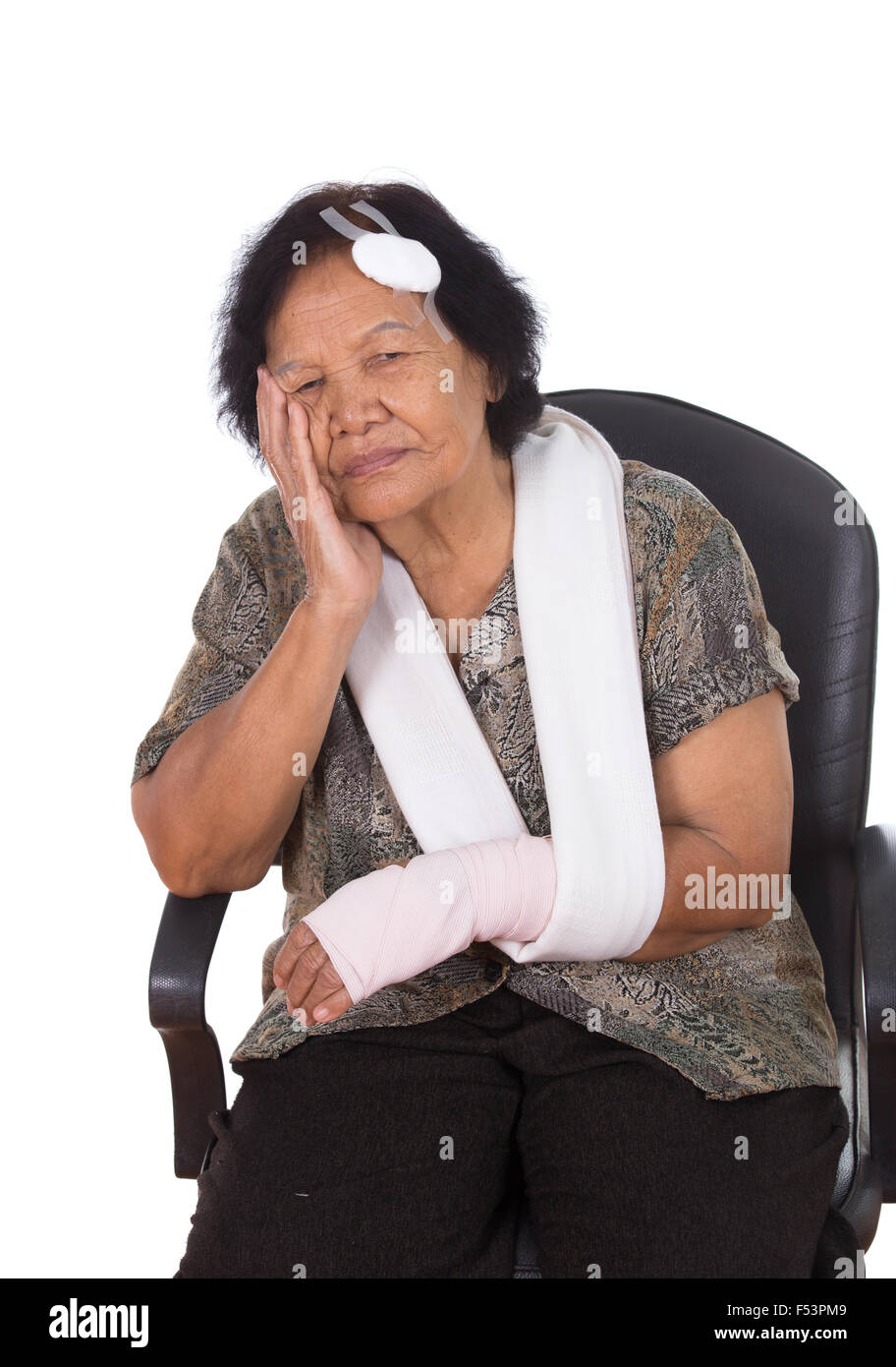 senior woman with head and hand injury isolated on white background ...