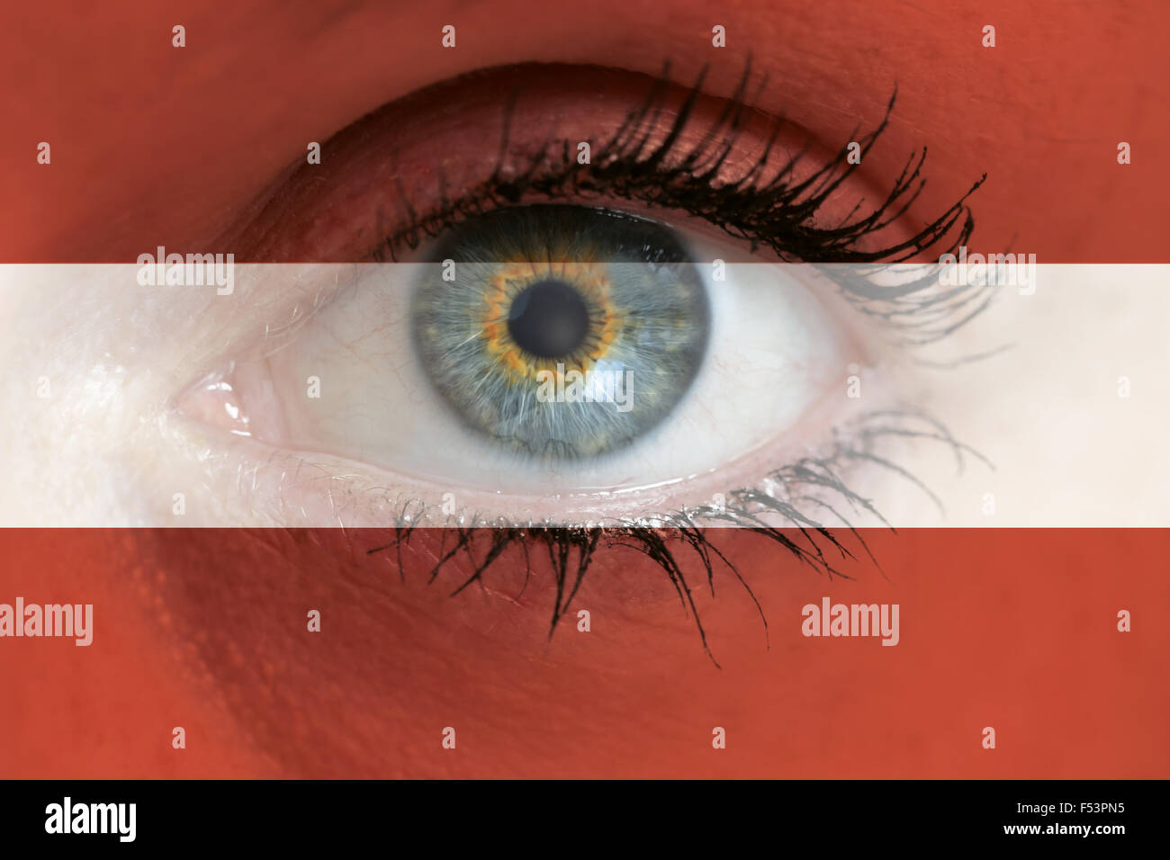 Eye looks through Austria flag background concept macro Stock Photo - Alamy