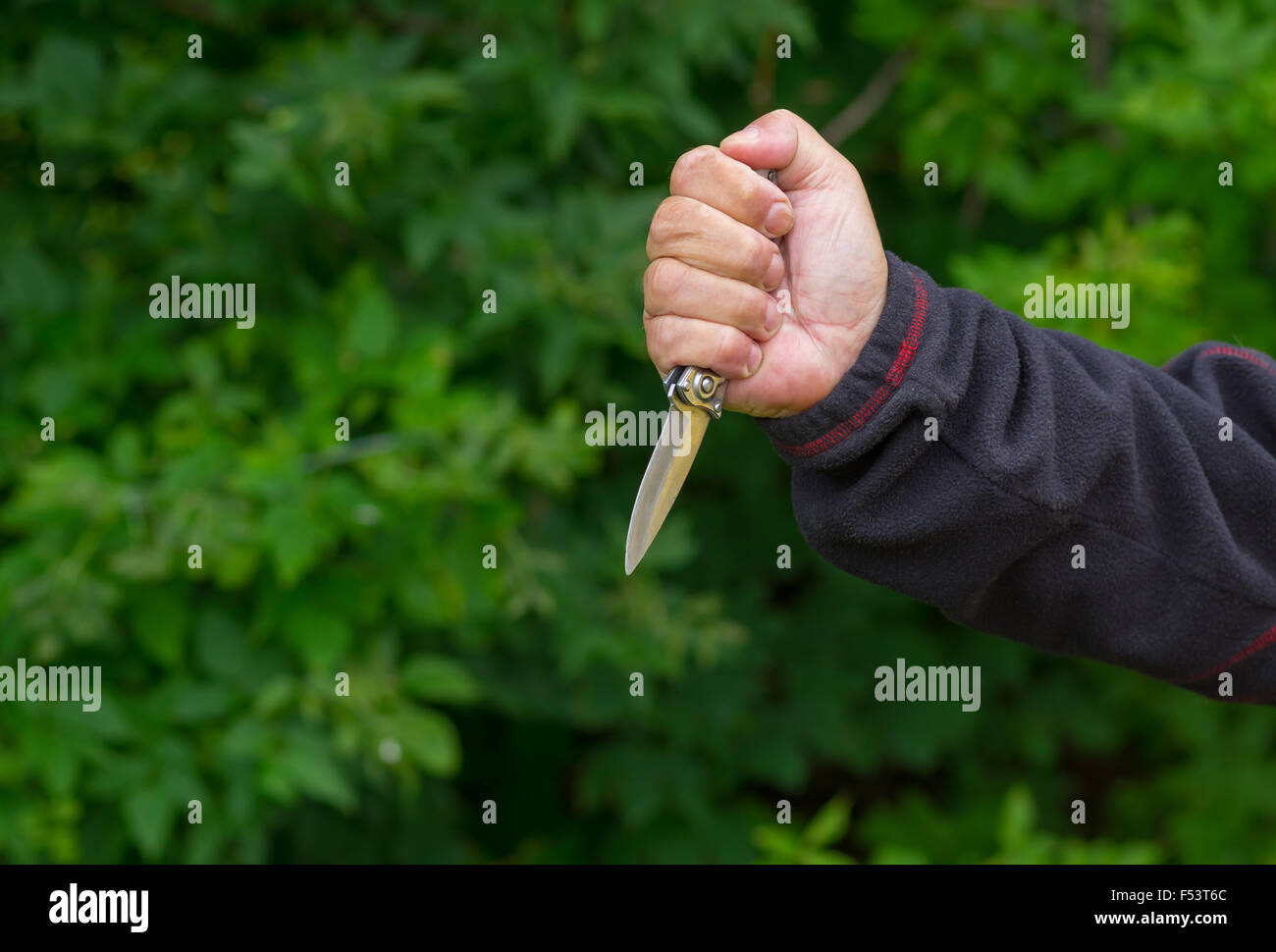 Man holding dagger hi-res stock photography and images - Alamy