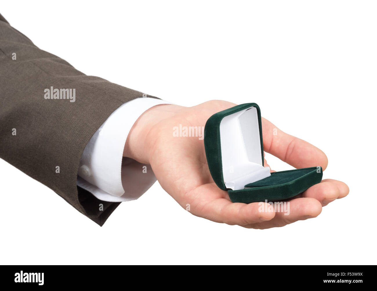 Open ring box in businessmans hand Stock Photo - Alamy