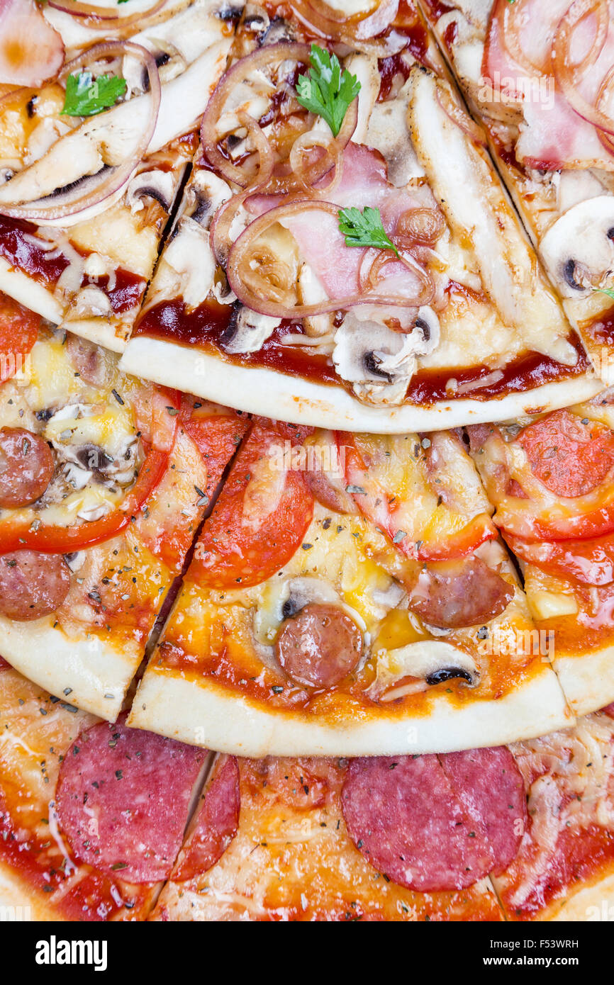 combo with three different slices of pizzas closeup from top. for ...