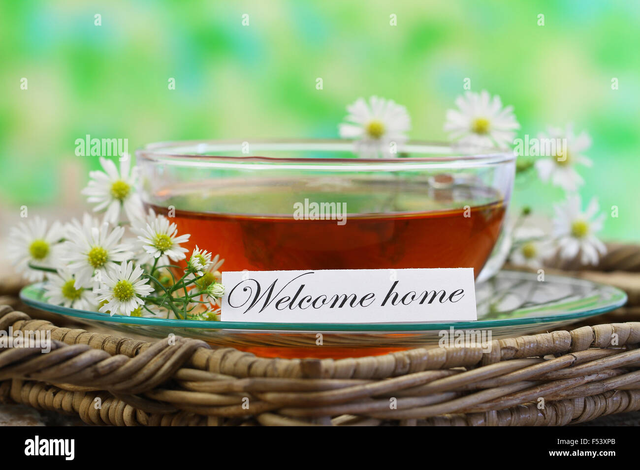 Welcome home note with cup of chamomile tea and copy space Stock Photo ...