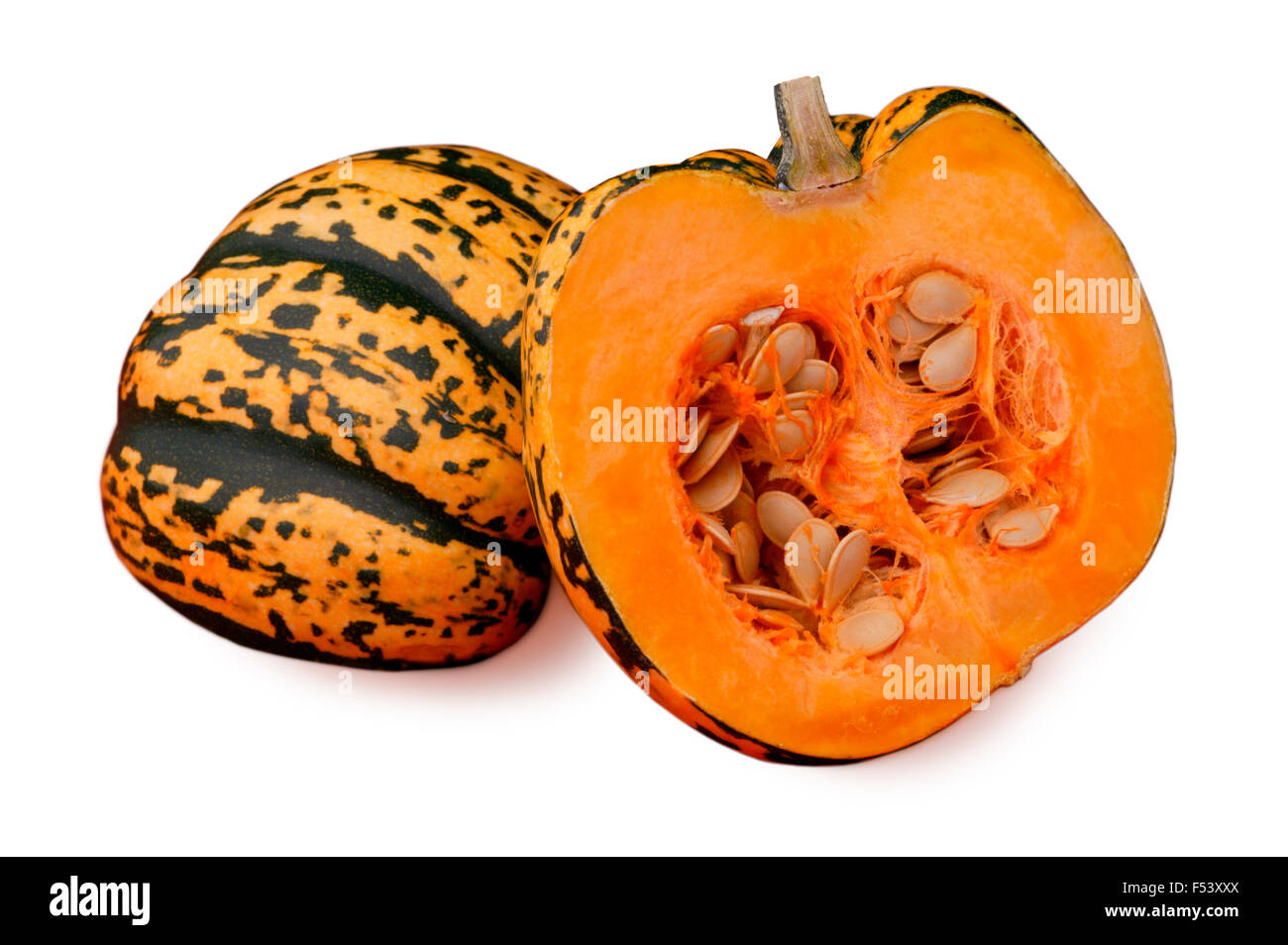 Harlequin squash cut in half Stock Photo - Alamy
