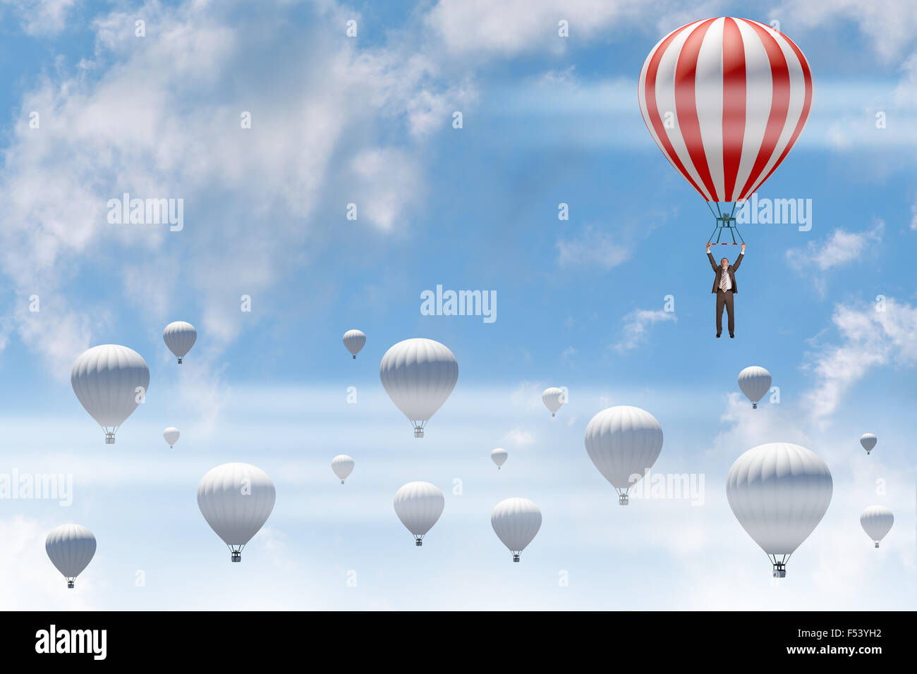 Businessman holding balloon Stock Photo - Alamy