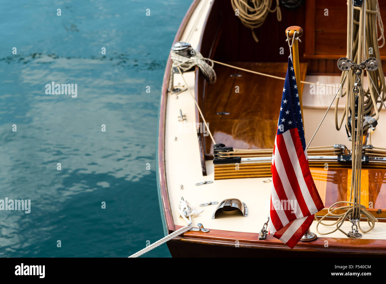 vintage wooden sailing boat with an american flag Stock Photo - Alamy