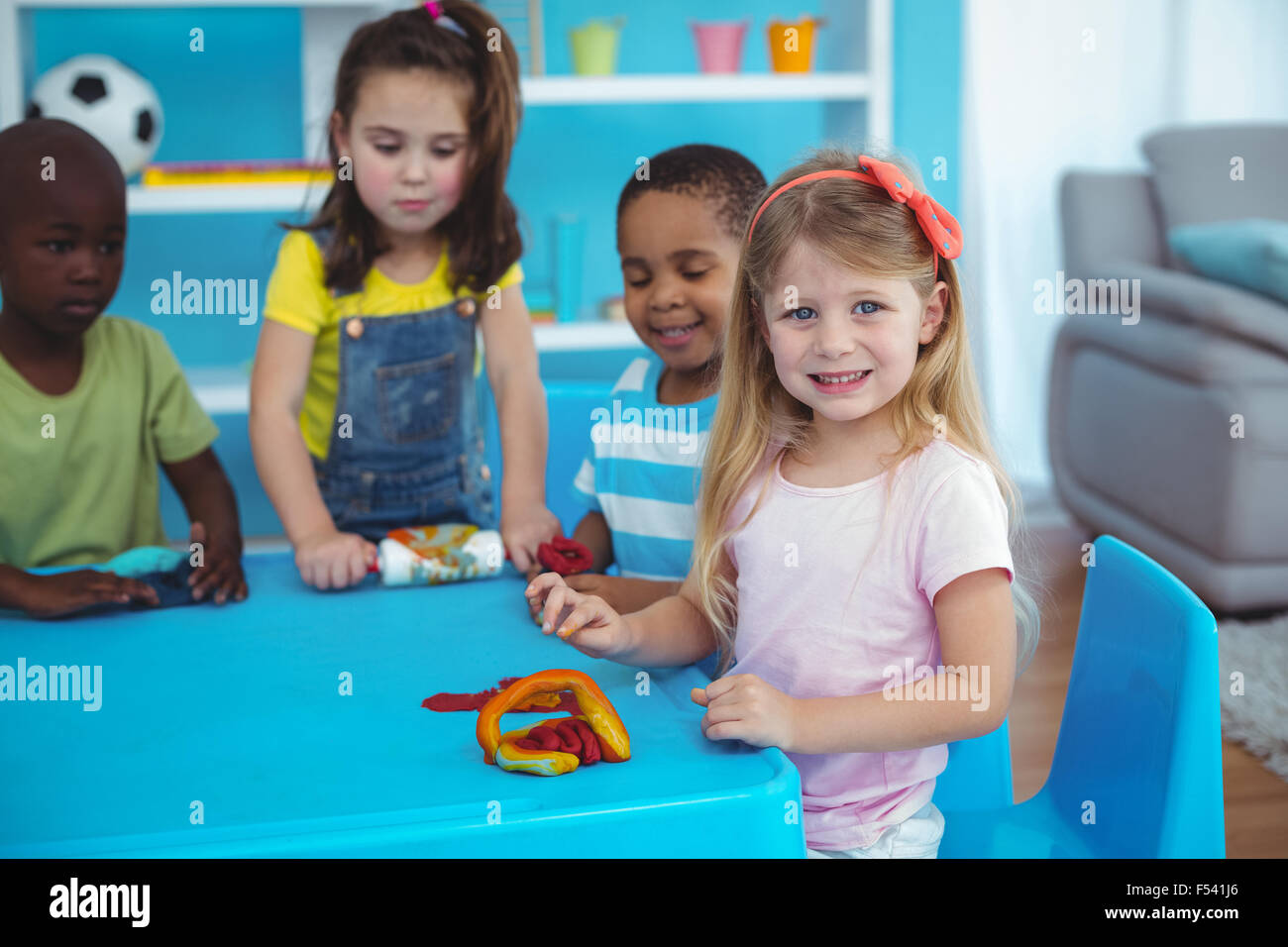 Happy kids enjoying arts and crafts together Stock Photo - Alamy