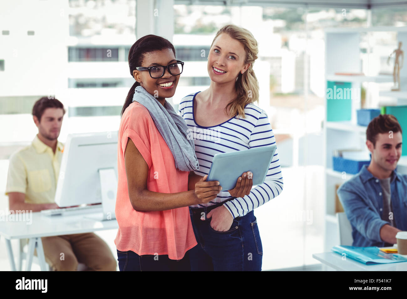 Creative team using tablet hi-res stock photography and images - Alamy