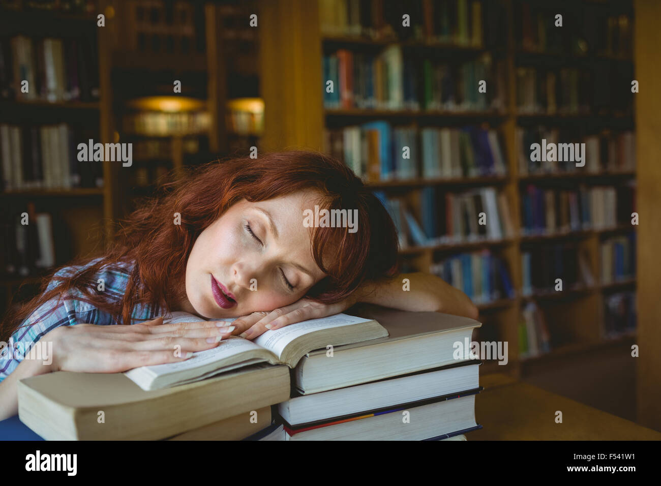 Student sleeping in library hi-res stock photography and images - Alamy
