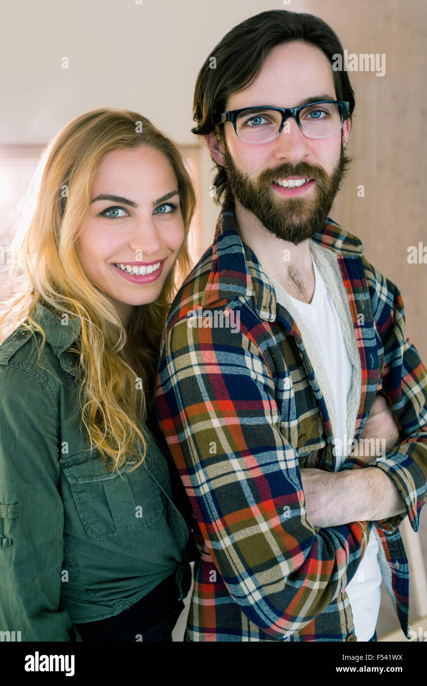 Creative team smiling at camera Stock Photo - Alamy