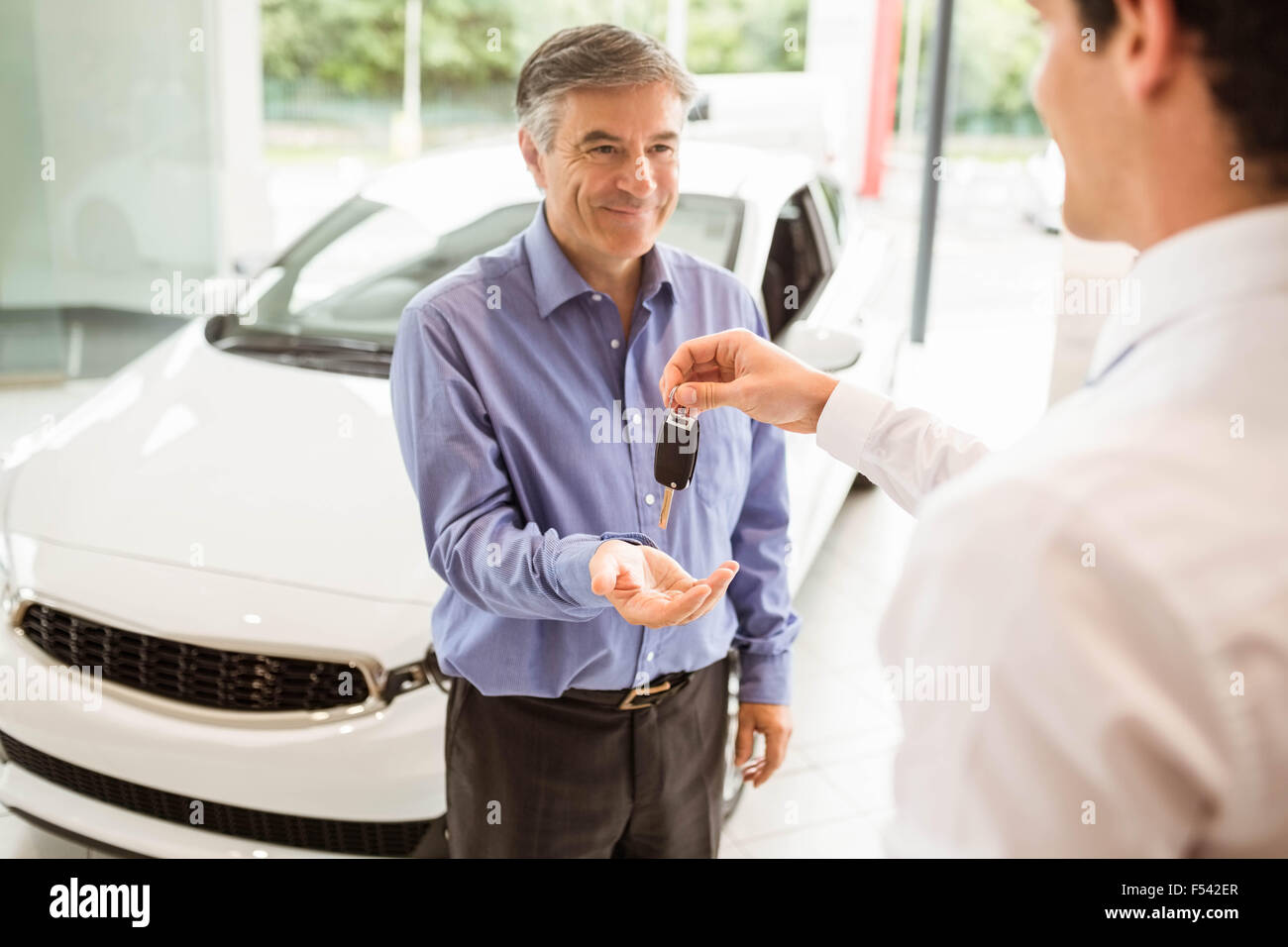 Giving a key car hi-res stock photography and images - Alamy