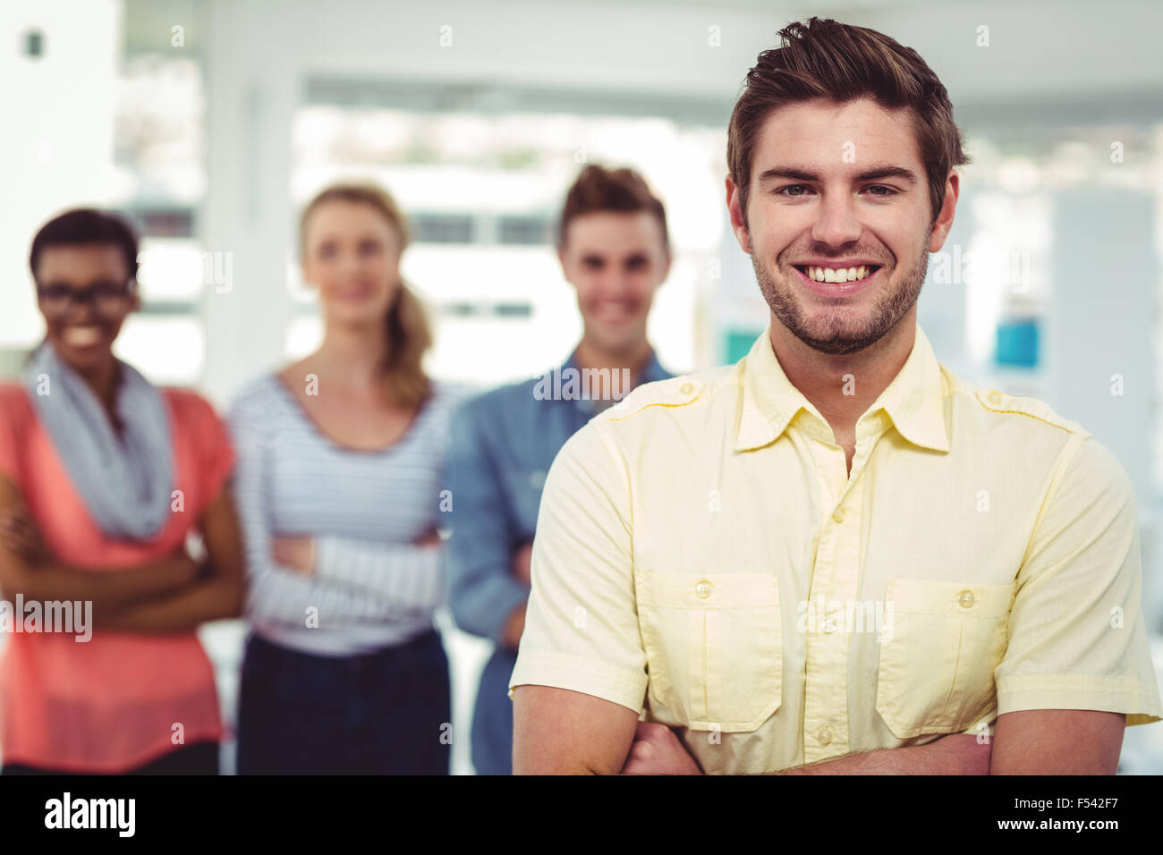 Happy creative team standing together Stock Photo - Alamy