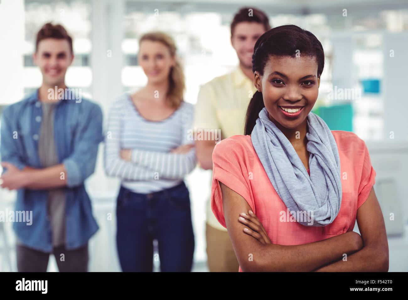 Happy creative team standing together Stock Photo - Alamy