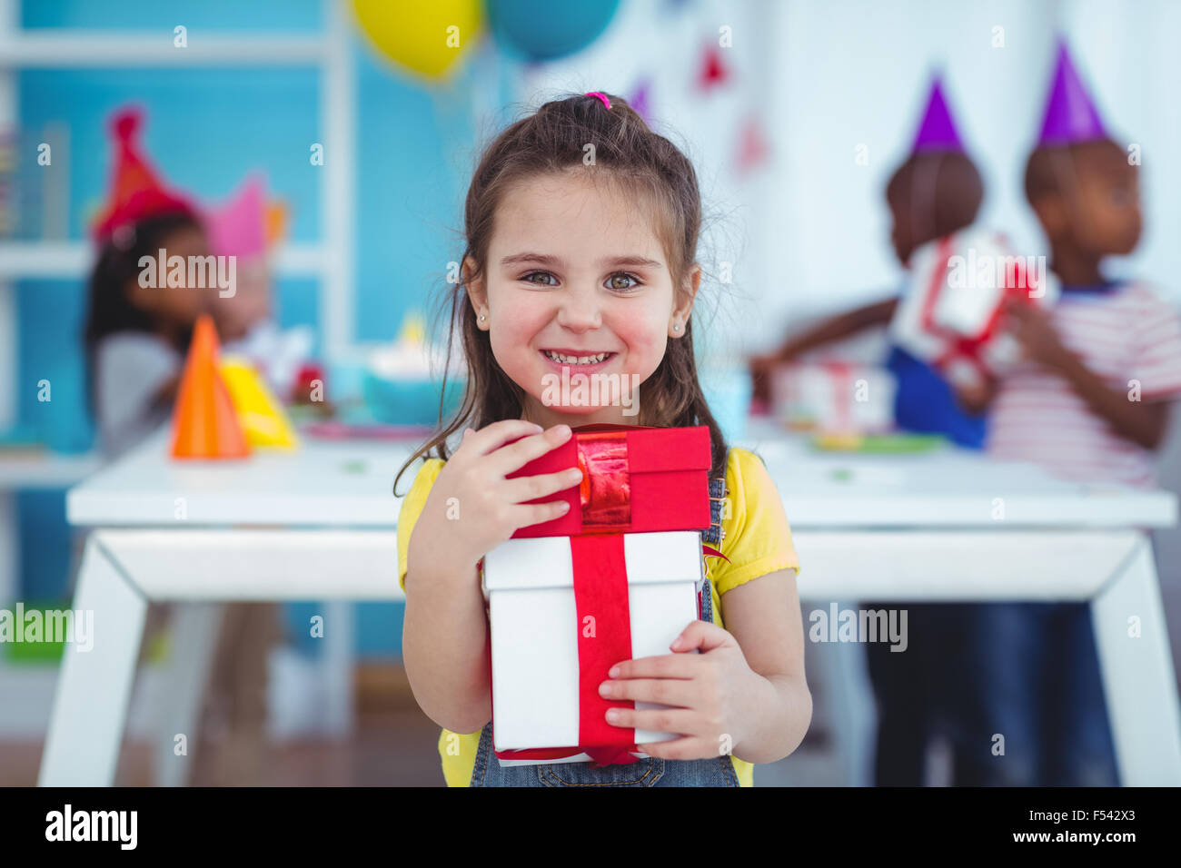 Happy kids at a birthday party Stock Photo - Alamy